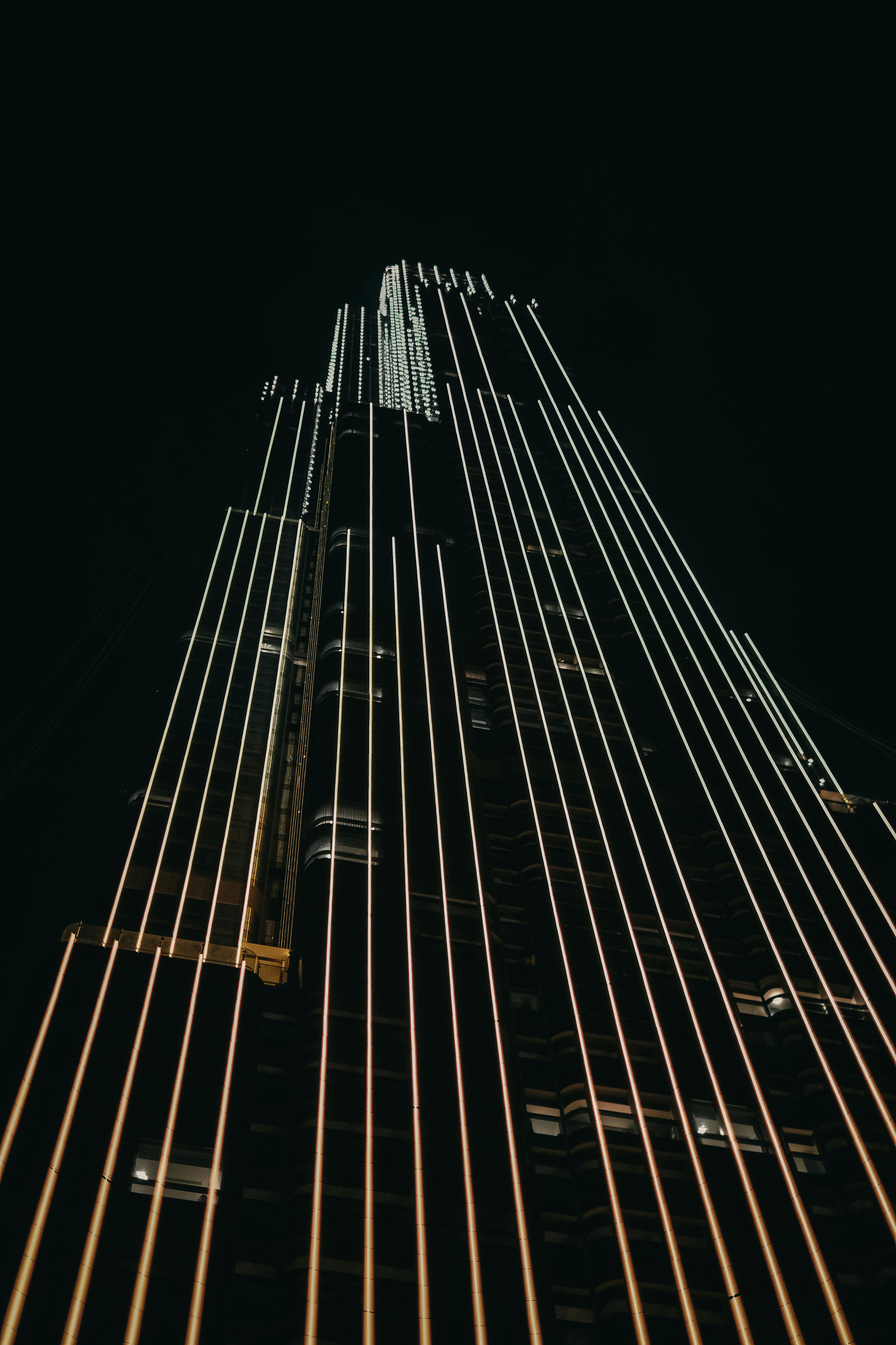 Black and Brown String Lights on a High Rise Building · Free Stock Photo