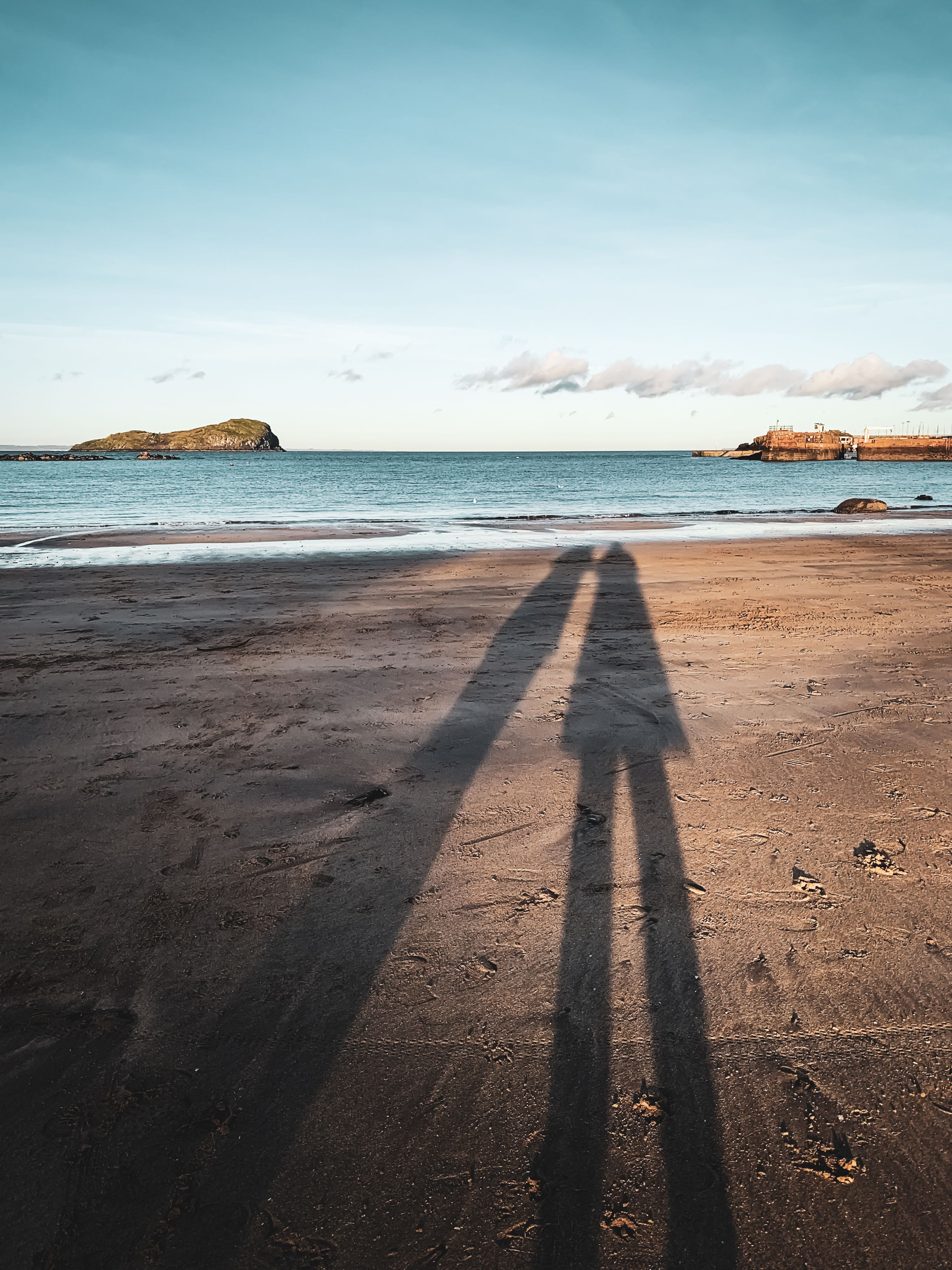 A Shadow of People on the Shore of a Beach · Free Stock Photo