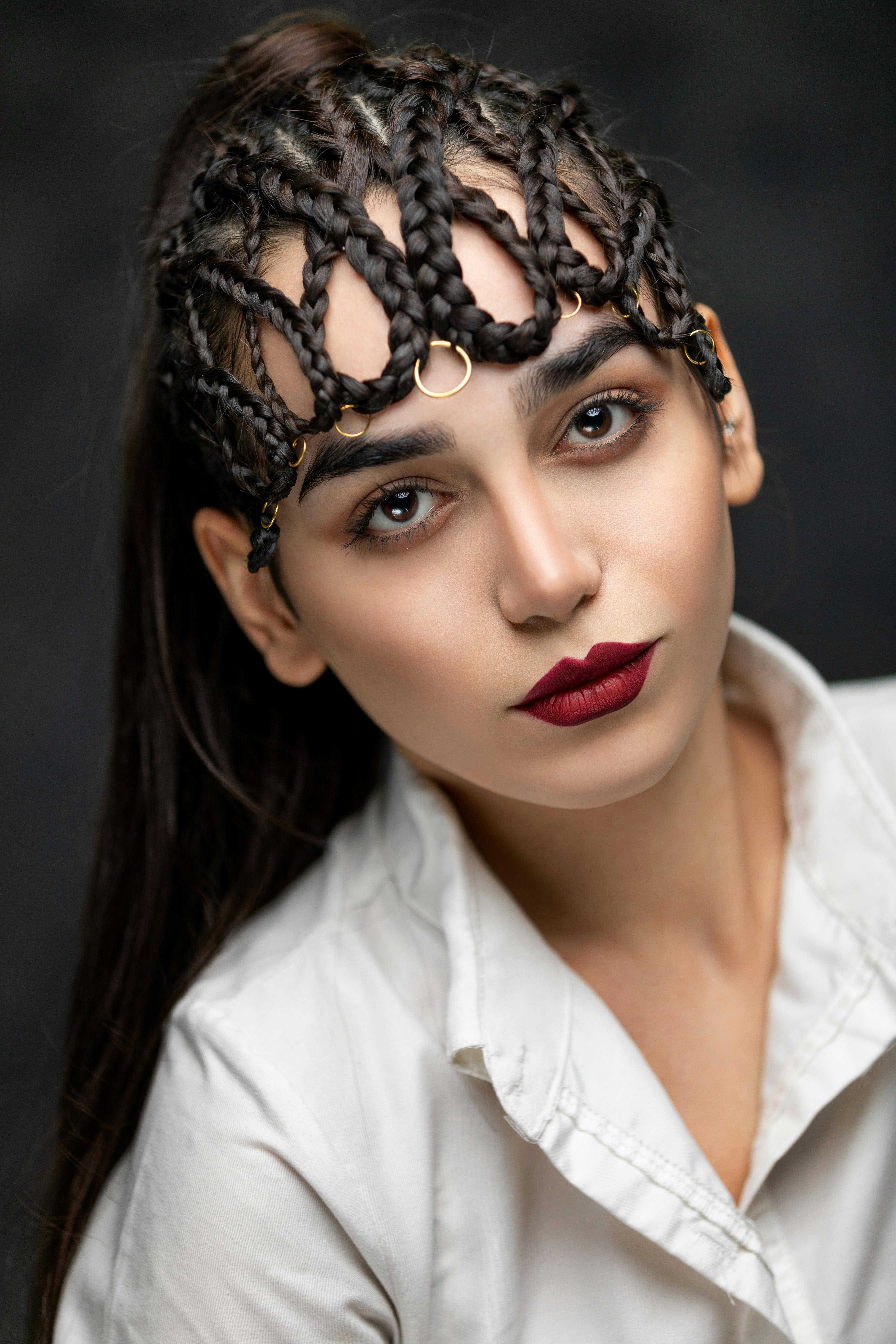 Portrait of Woman with Artistic Braids Hairstyle · Free Stock Photo