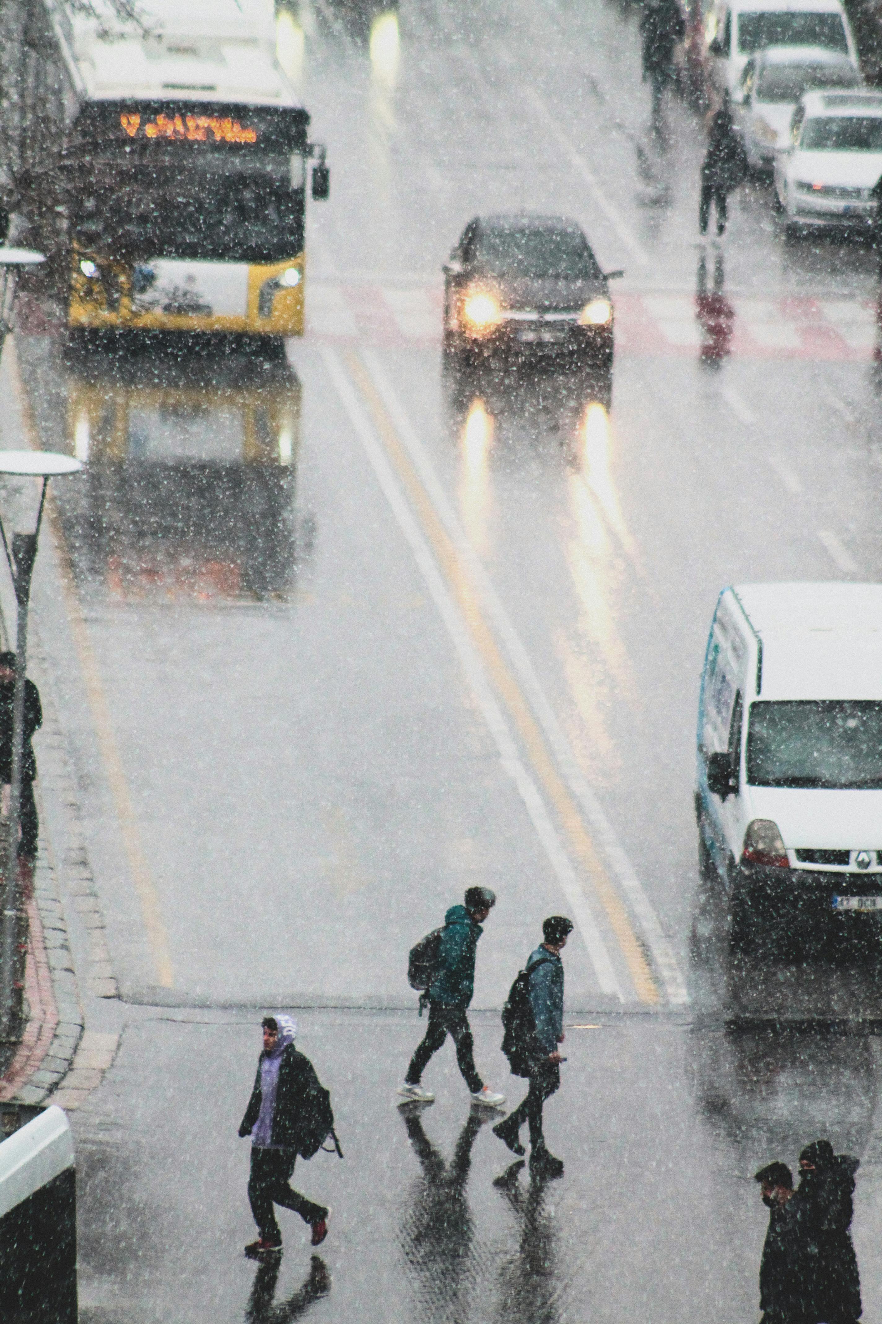 People Walking on Street while Raining · Free Stock Photo