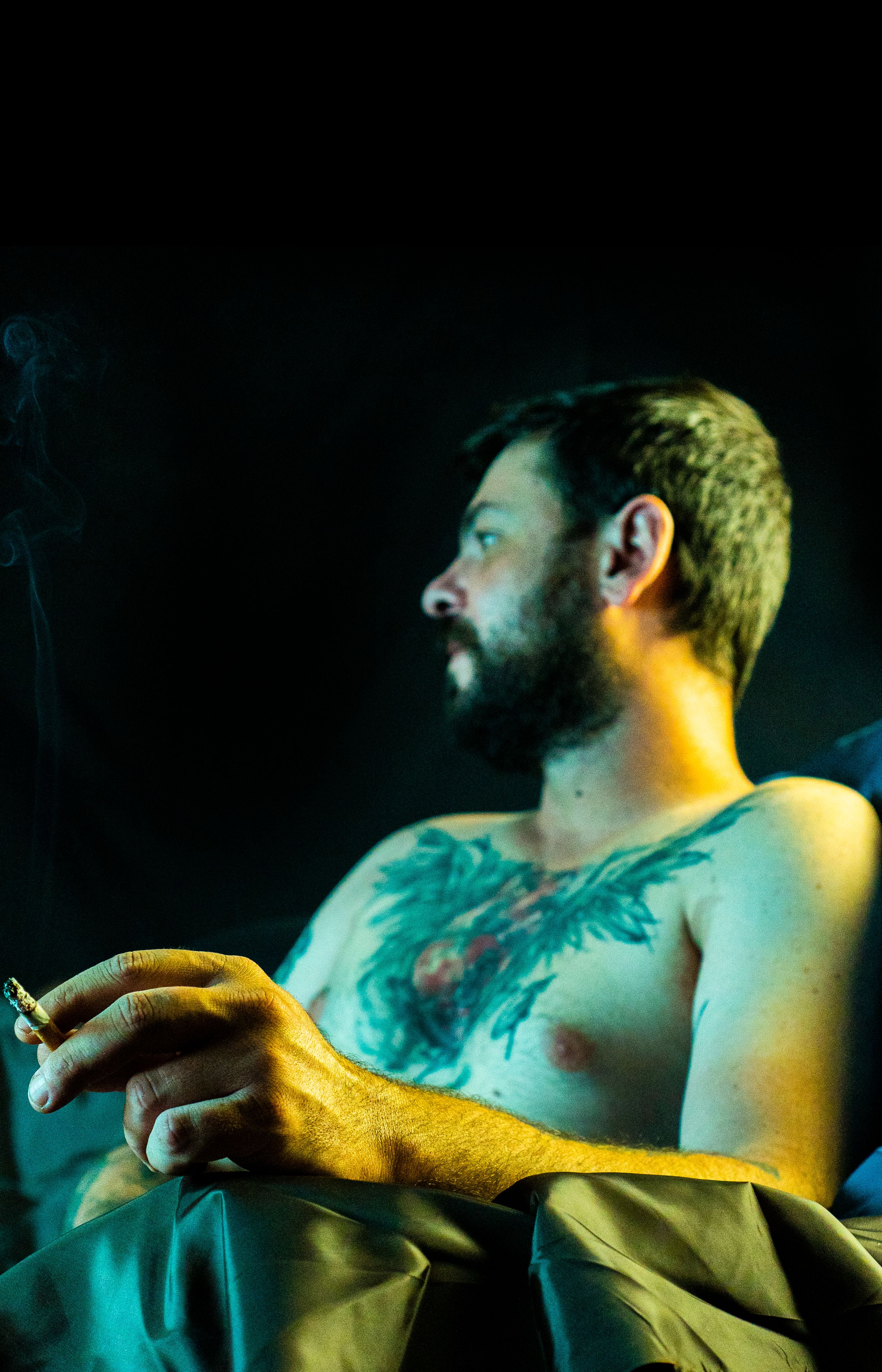 Man with Tattoos Blowing Smoke From His Nose · Free Stock Photo