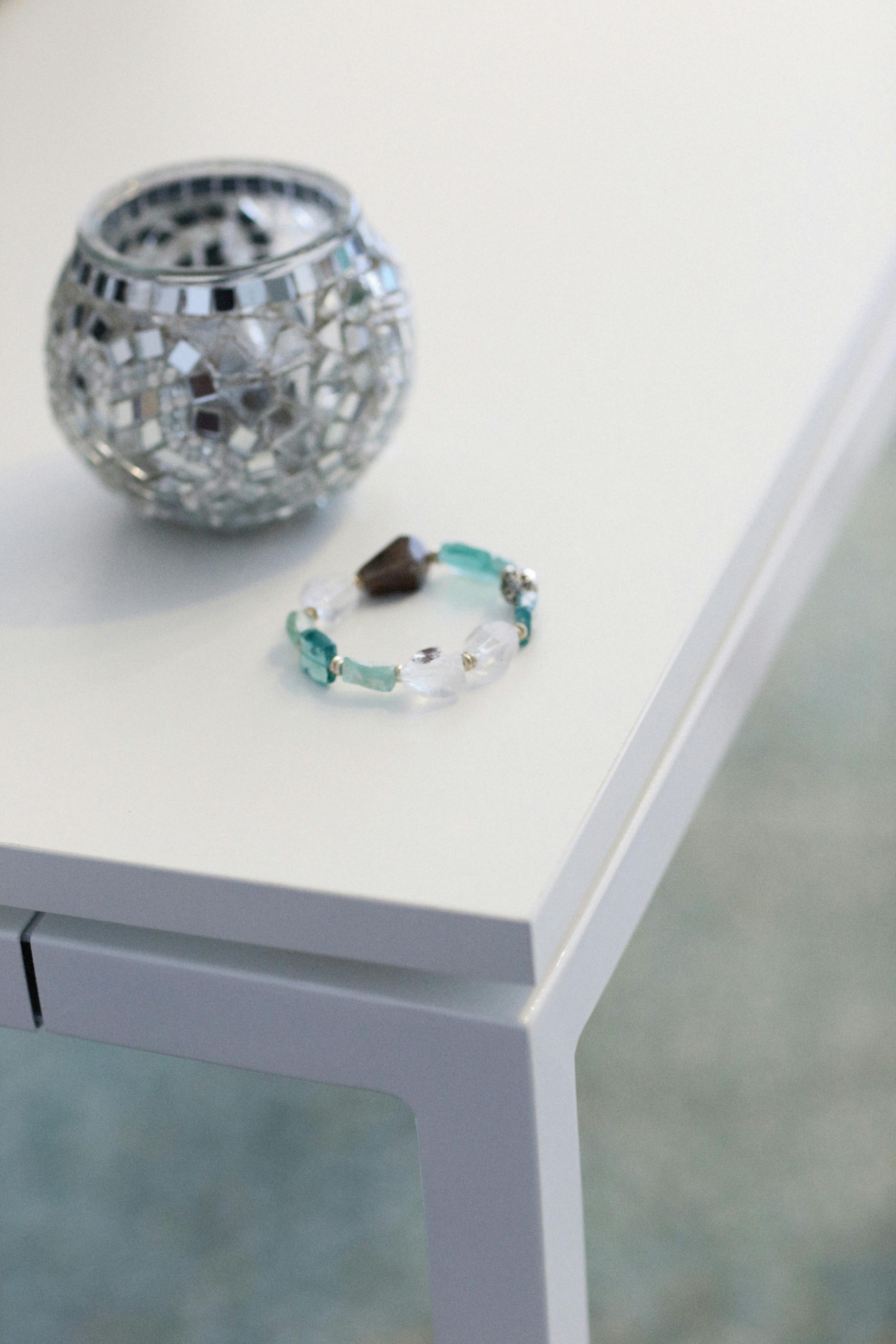 A Gemstone Bracelet On The Corner Of The Table Photos, Download The ...