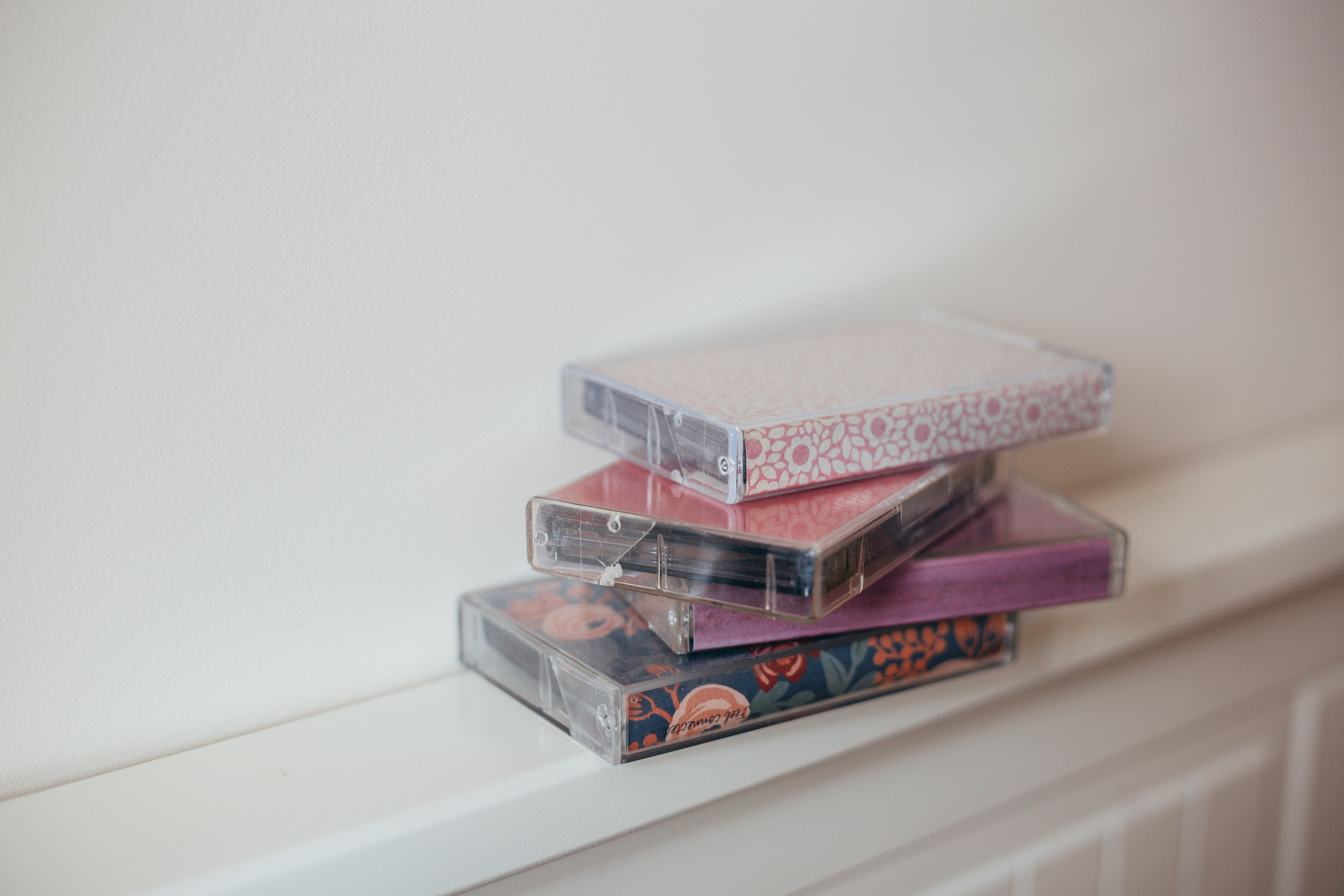 Close-Up Shot of Cassette Tape and Cassette Player · Free Stock Photo