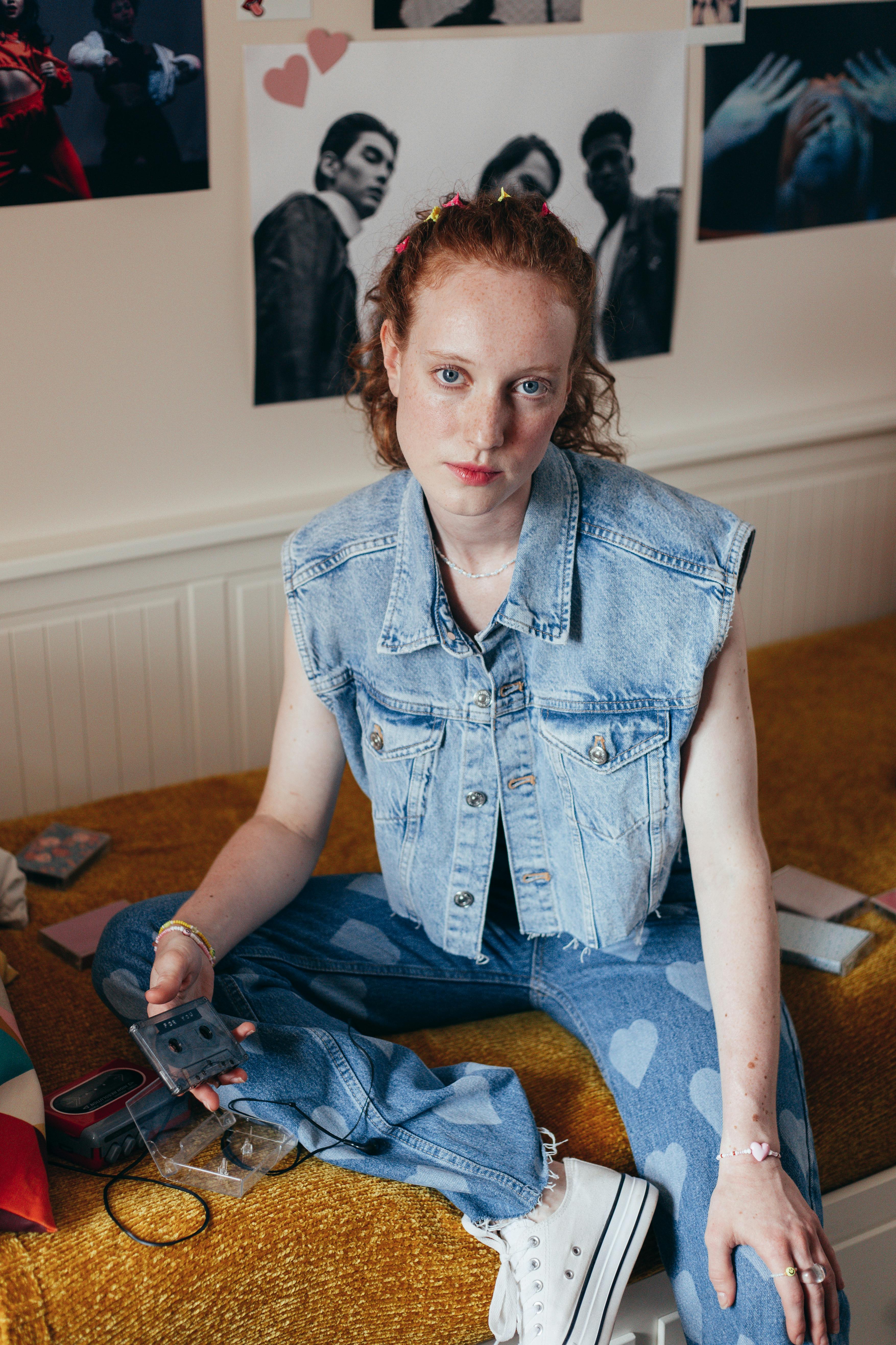 Woman in Blue Denim Button Up Vest Holding a Walkman · Free Stock Photo