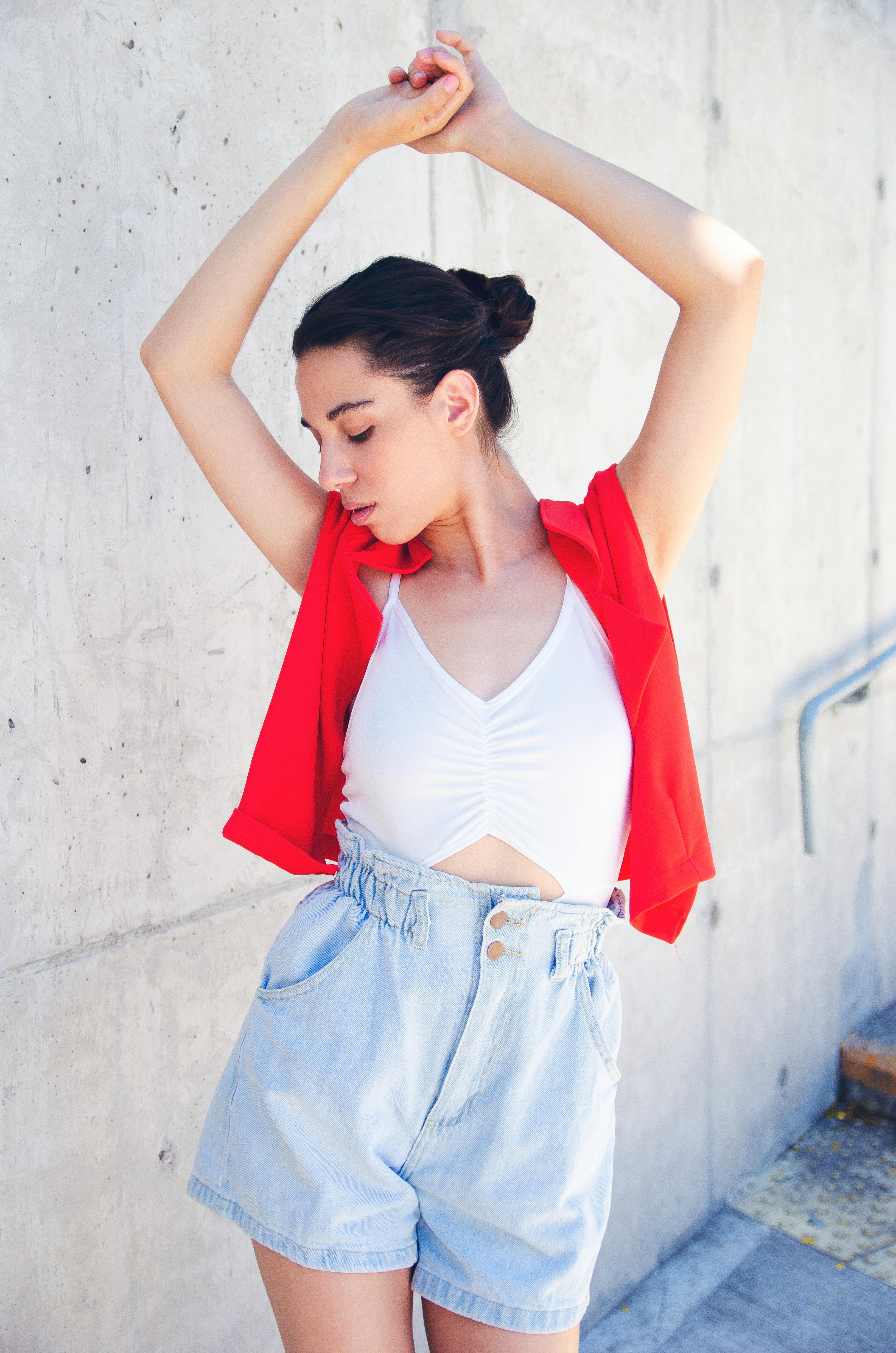 Woman with her Arms Raised · Free Stock Photo