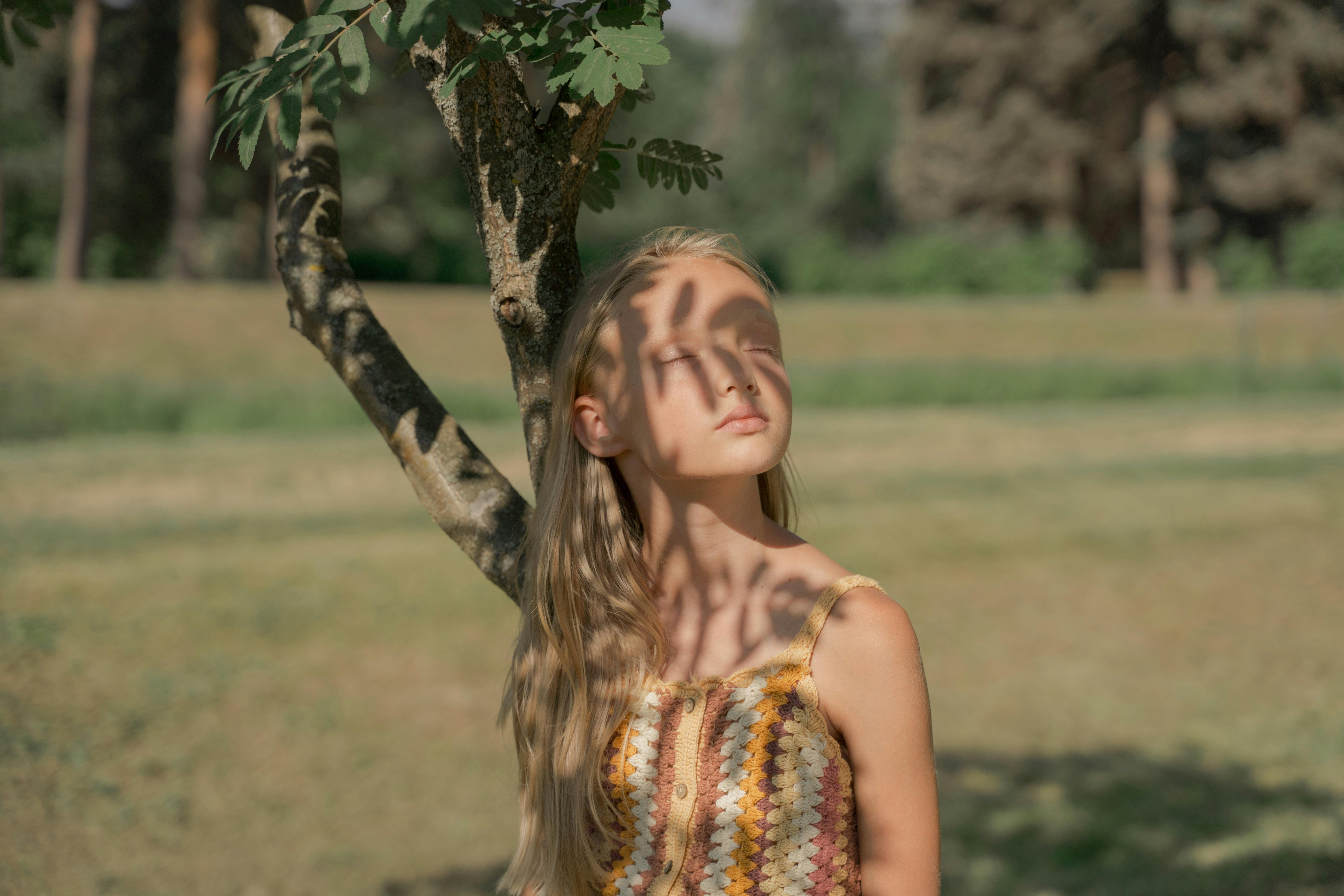 Girl Standing next to Tree · Free Stock Photo