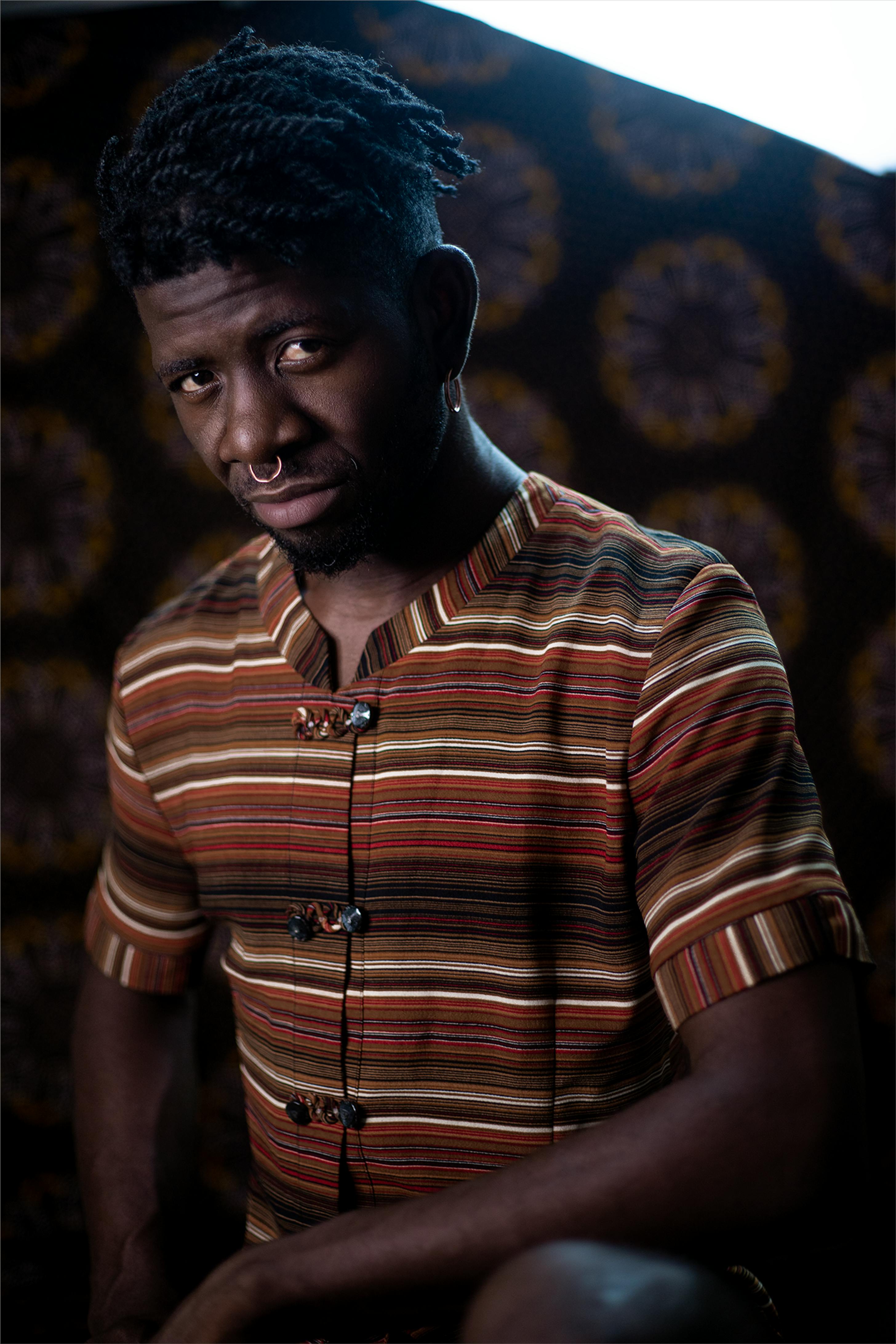 A Man Raising his Hand doing Posing · Free Stock Photo