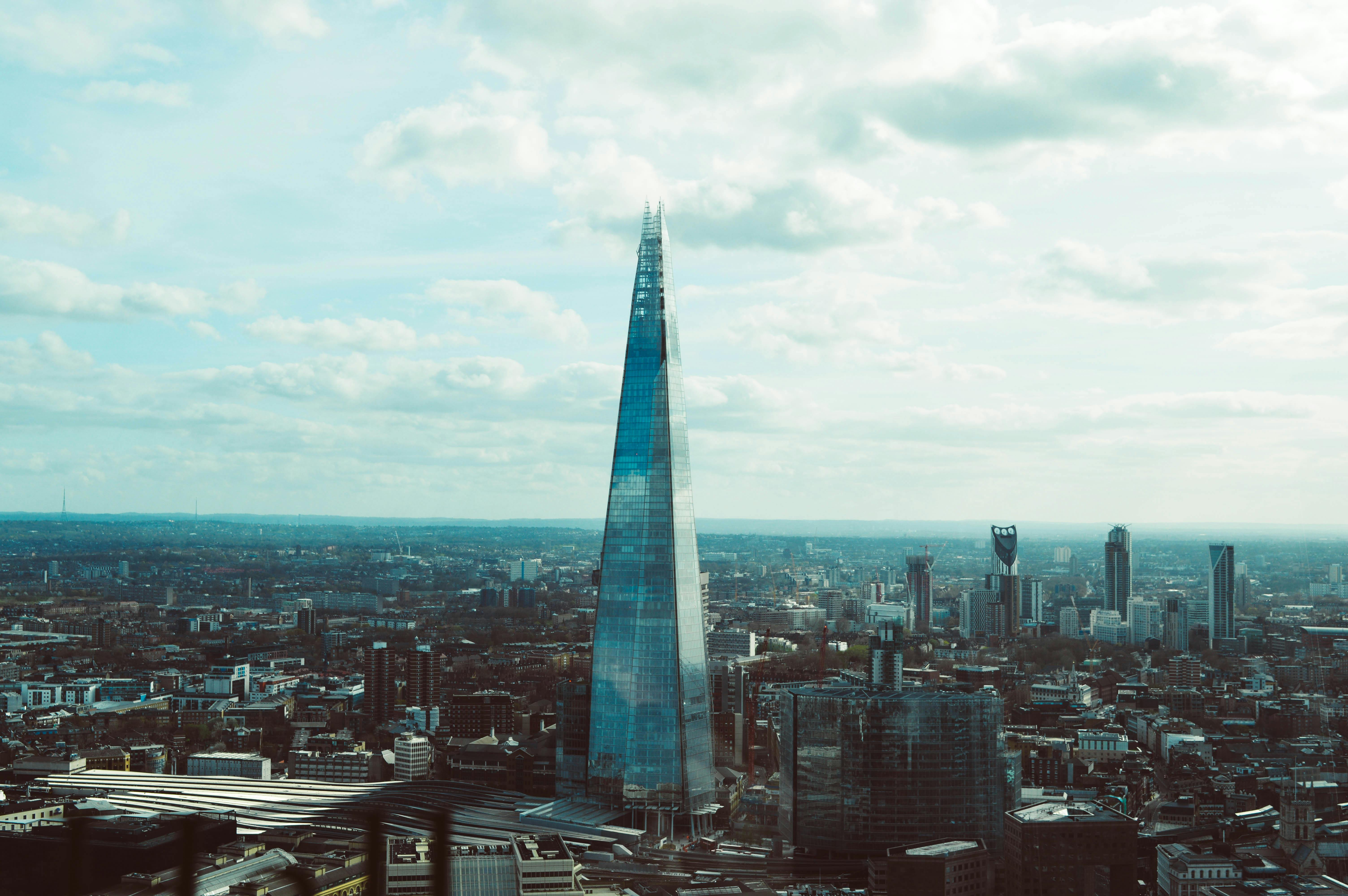 Cumulus Clouds Above High-rise Building · Free Stock Photo