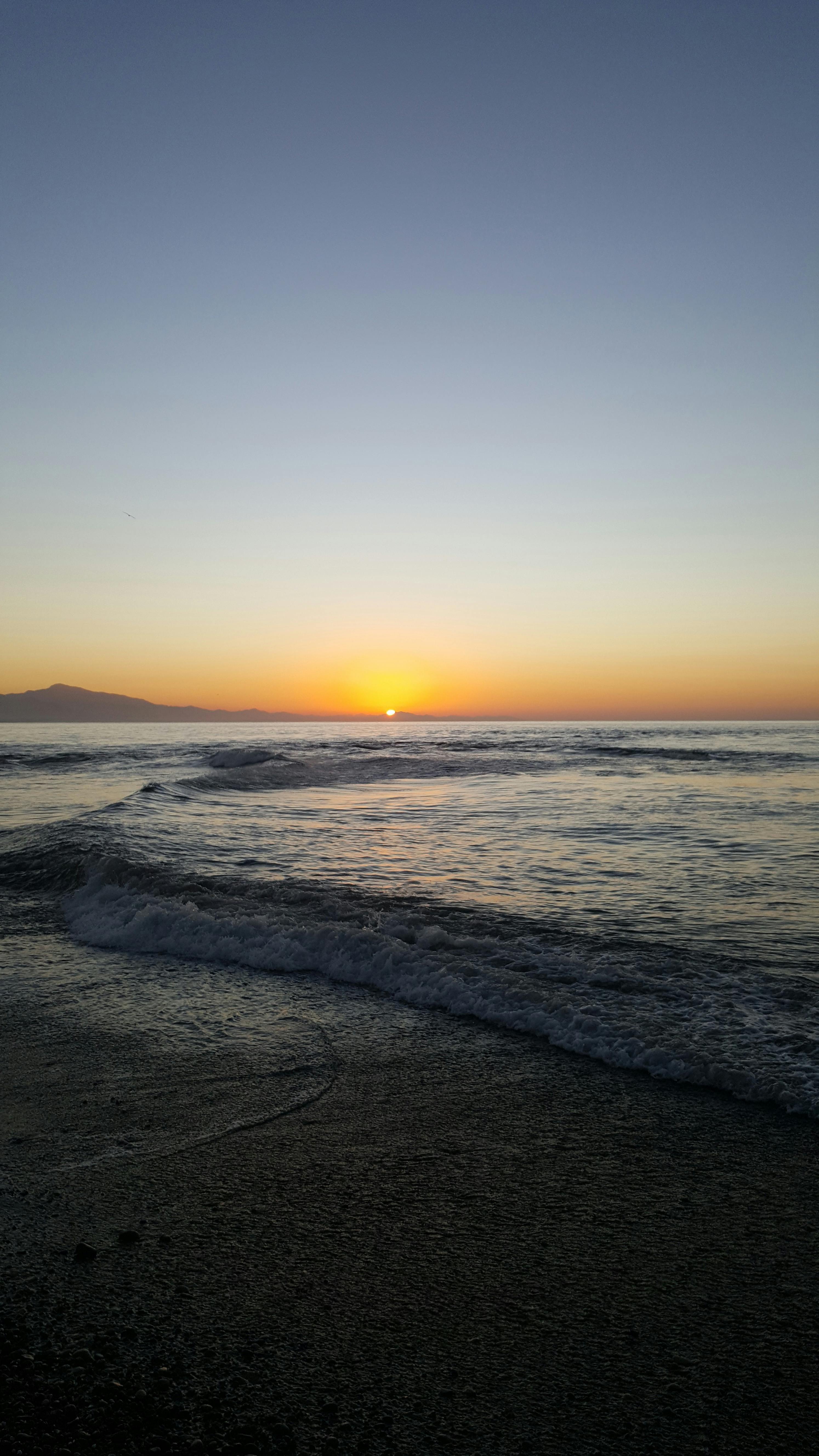 Sunset over Sea Shore · Free Stock Photo
