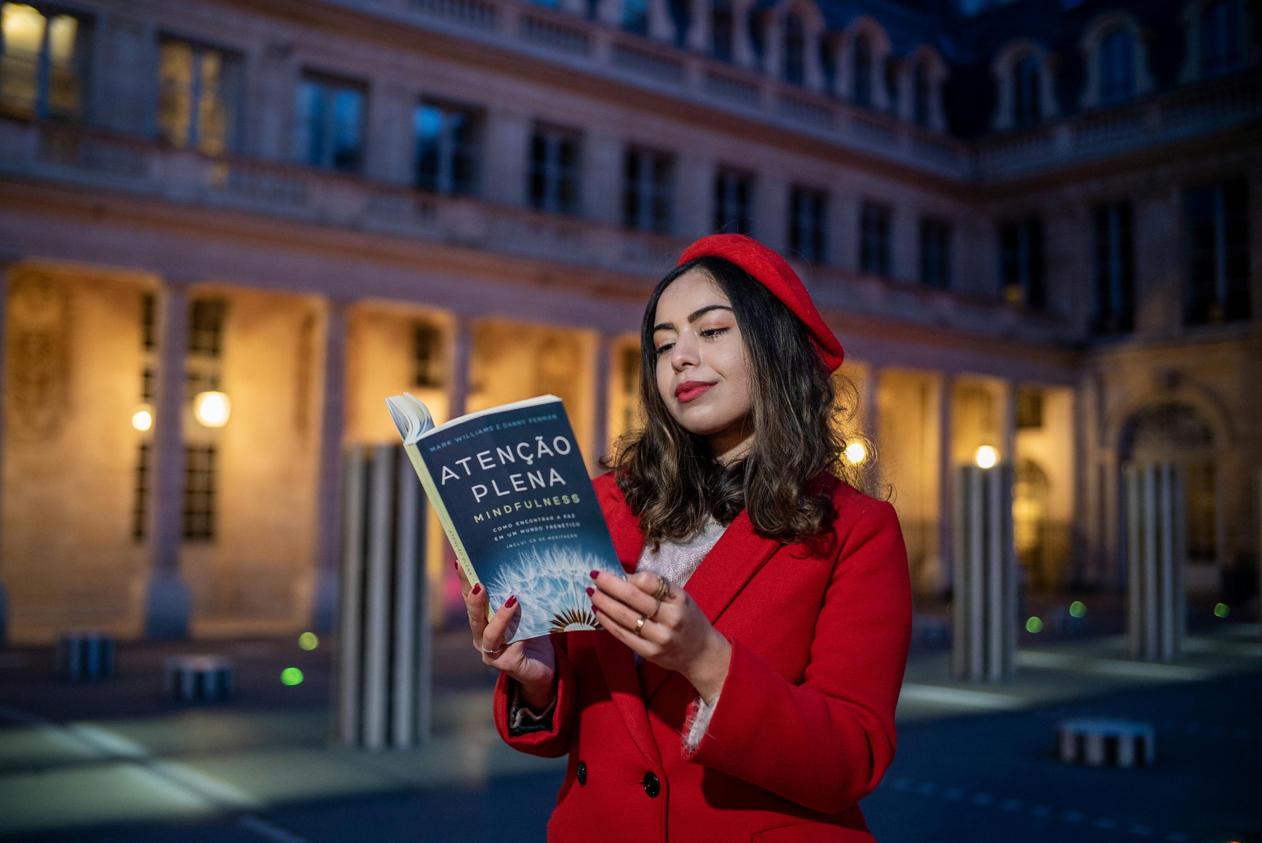 Woman in a Red Coat Reading a Book · Free Stock Photo
