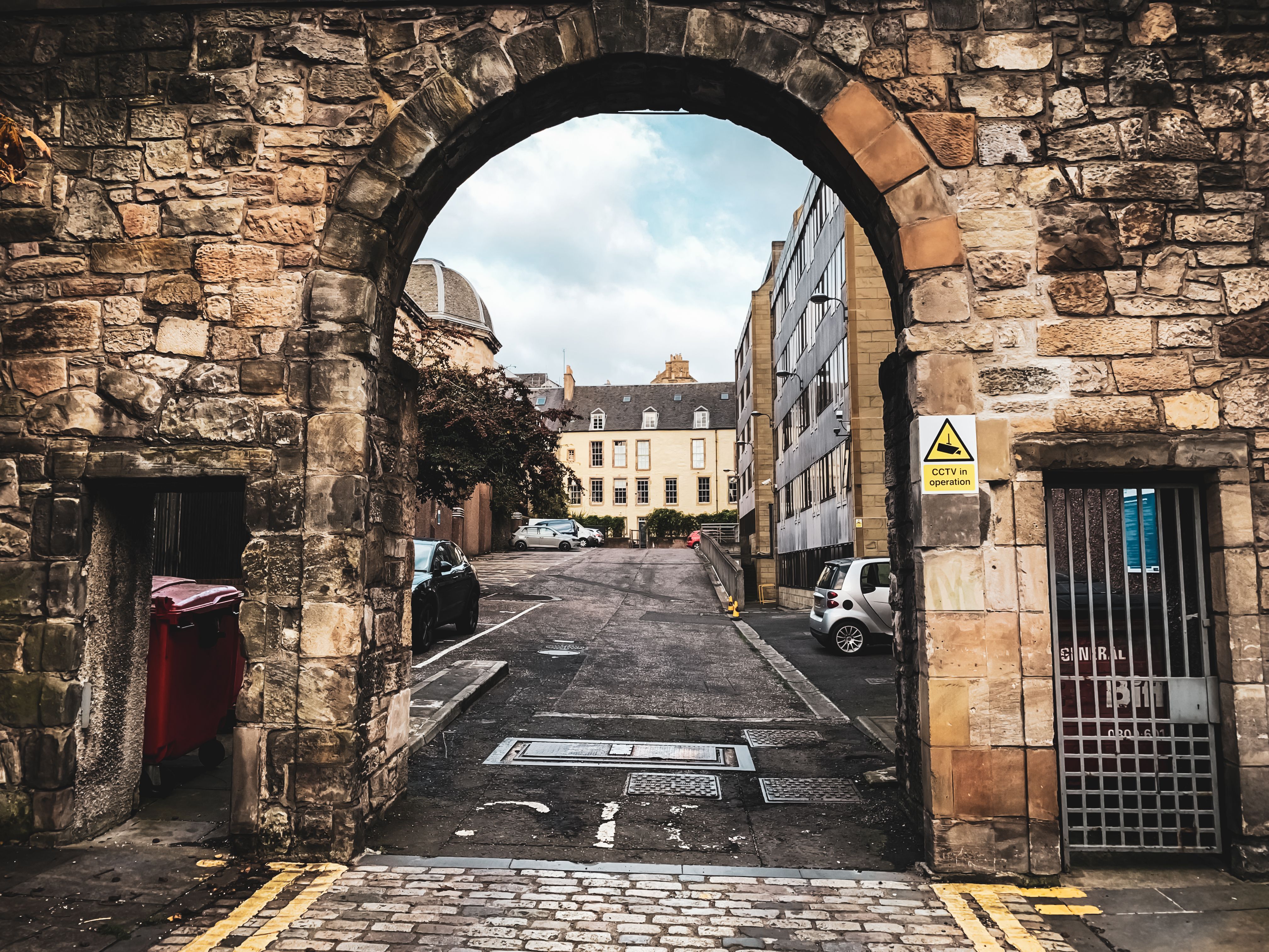 A Stonewall with an Arch on Entrance · Free Stock Photo