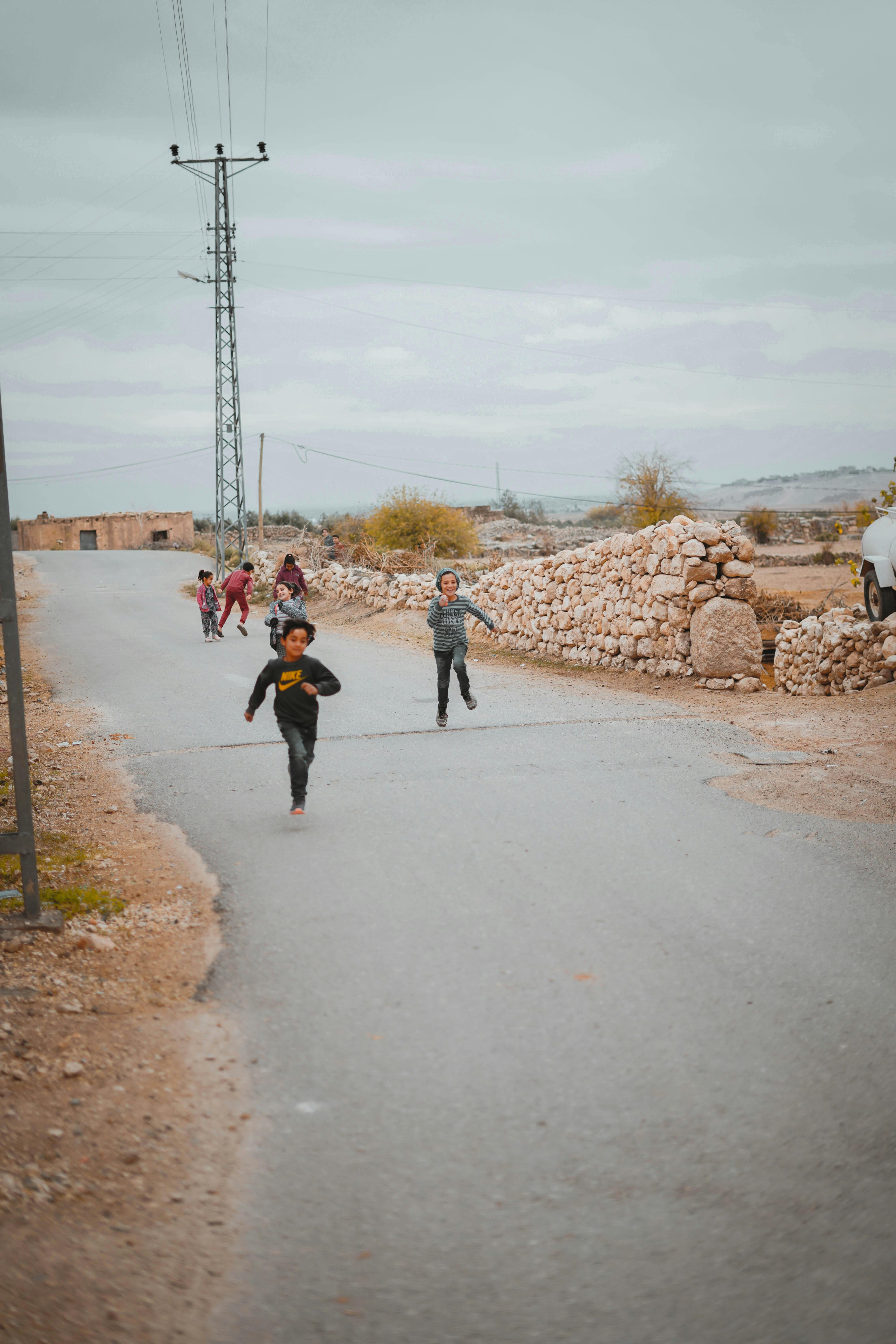 People Running on Gray Asphalt Road · Free Stock Photo