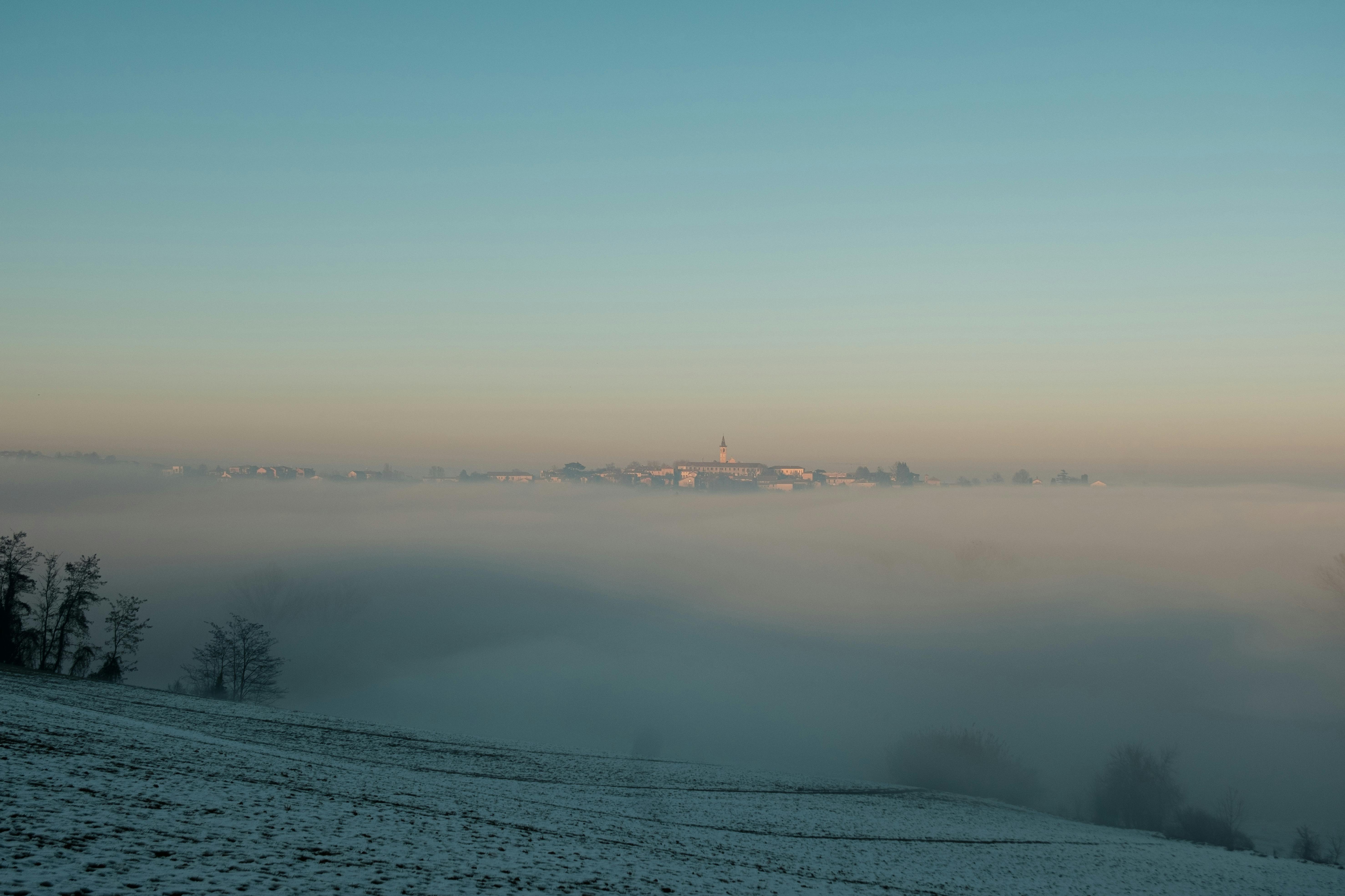 Mist Covering Town at Sunset · Free Stock Photo