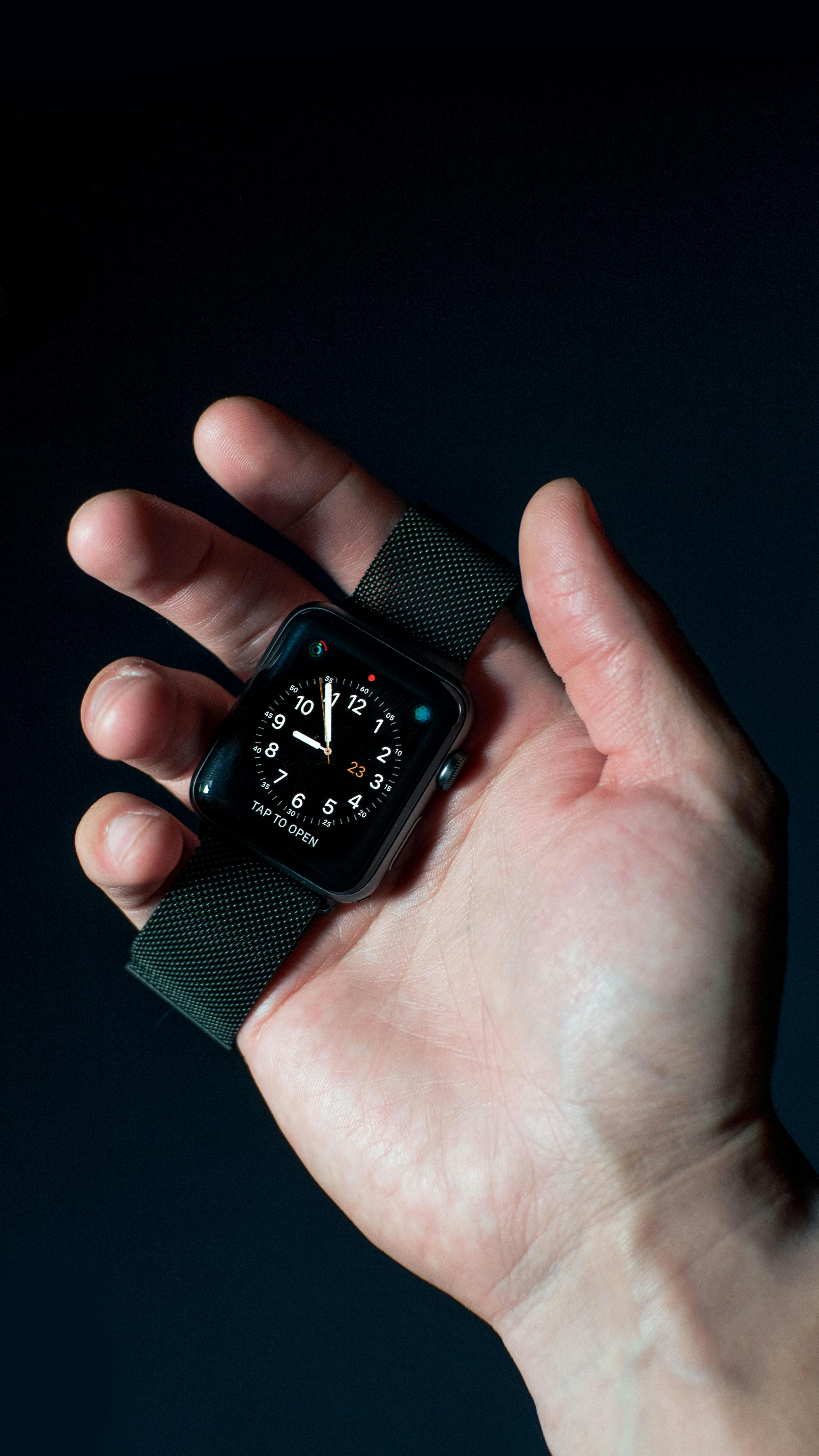 A Person Holding an Apple Watch · Free Stock Photo