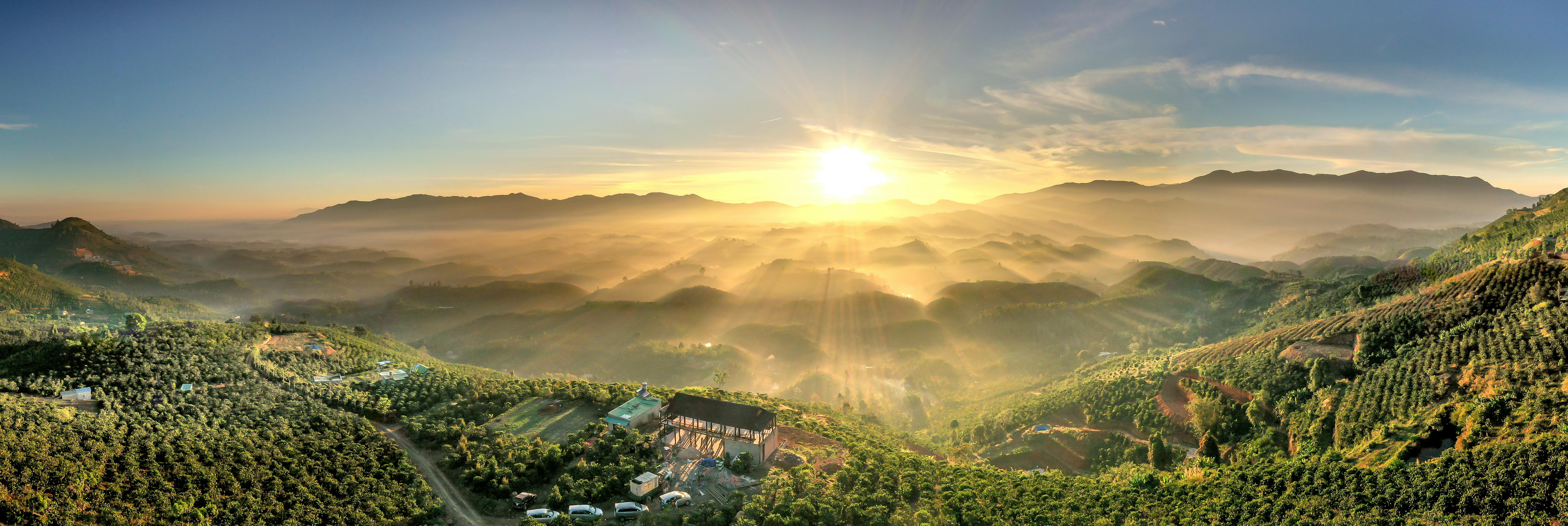Fog and Sunlight Over Hills and Mountains · Free Stock Photo