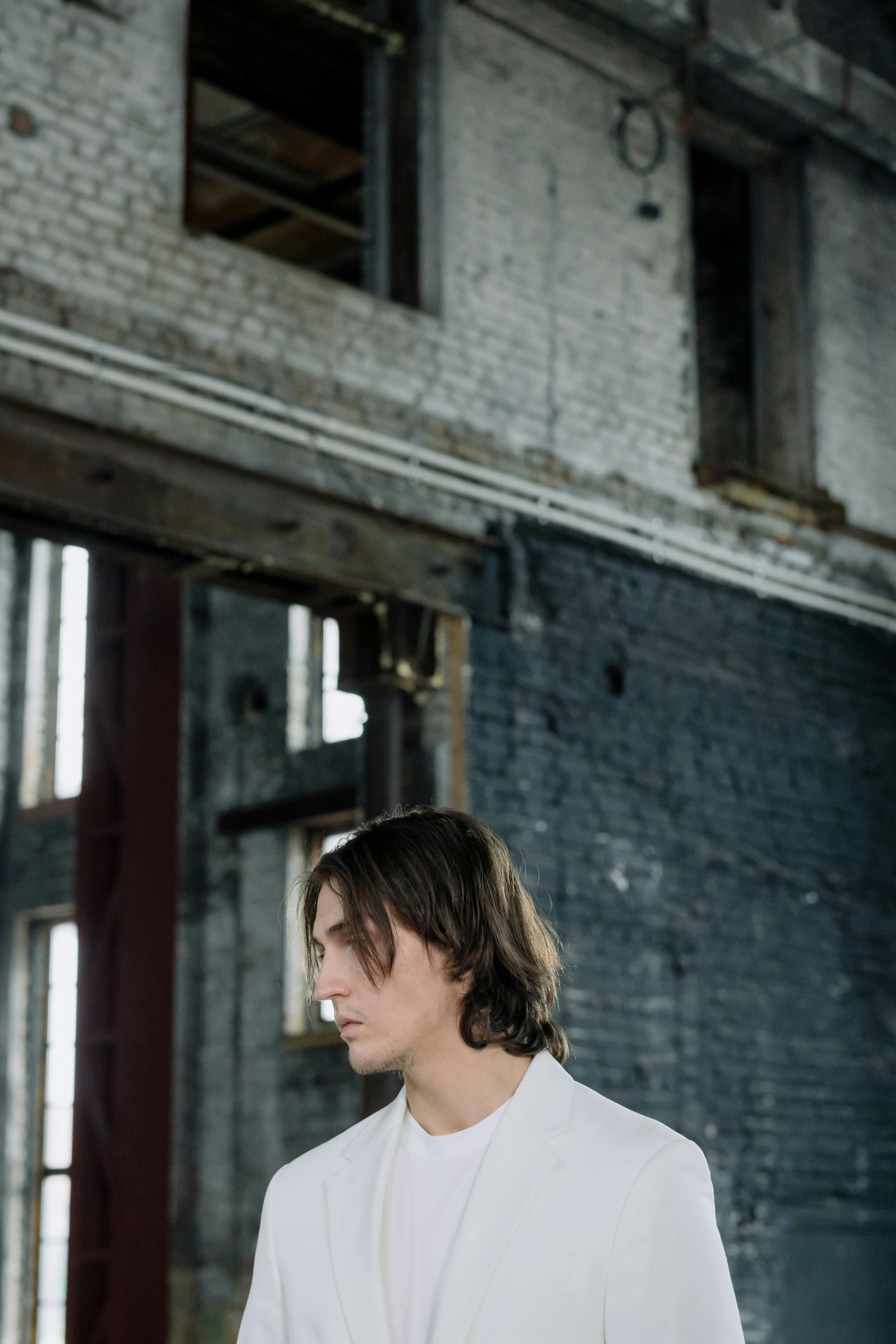 Man Hiding Behind A Concrete Wall · Free Stock Photo
