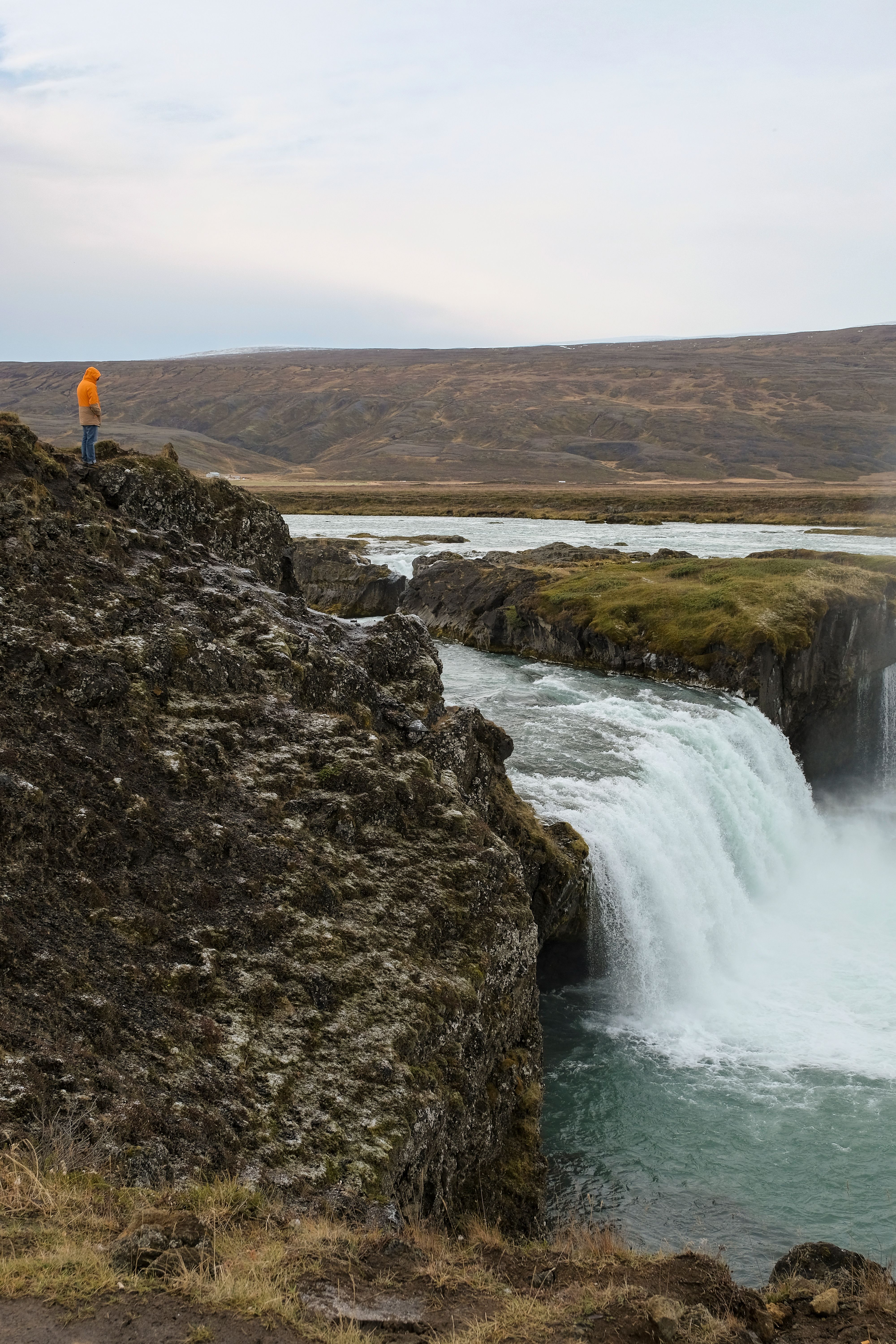 Man Sitting Near Waterfalls · Free Stock Photo
