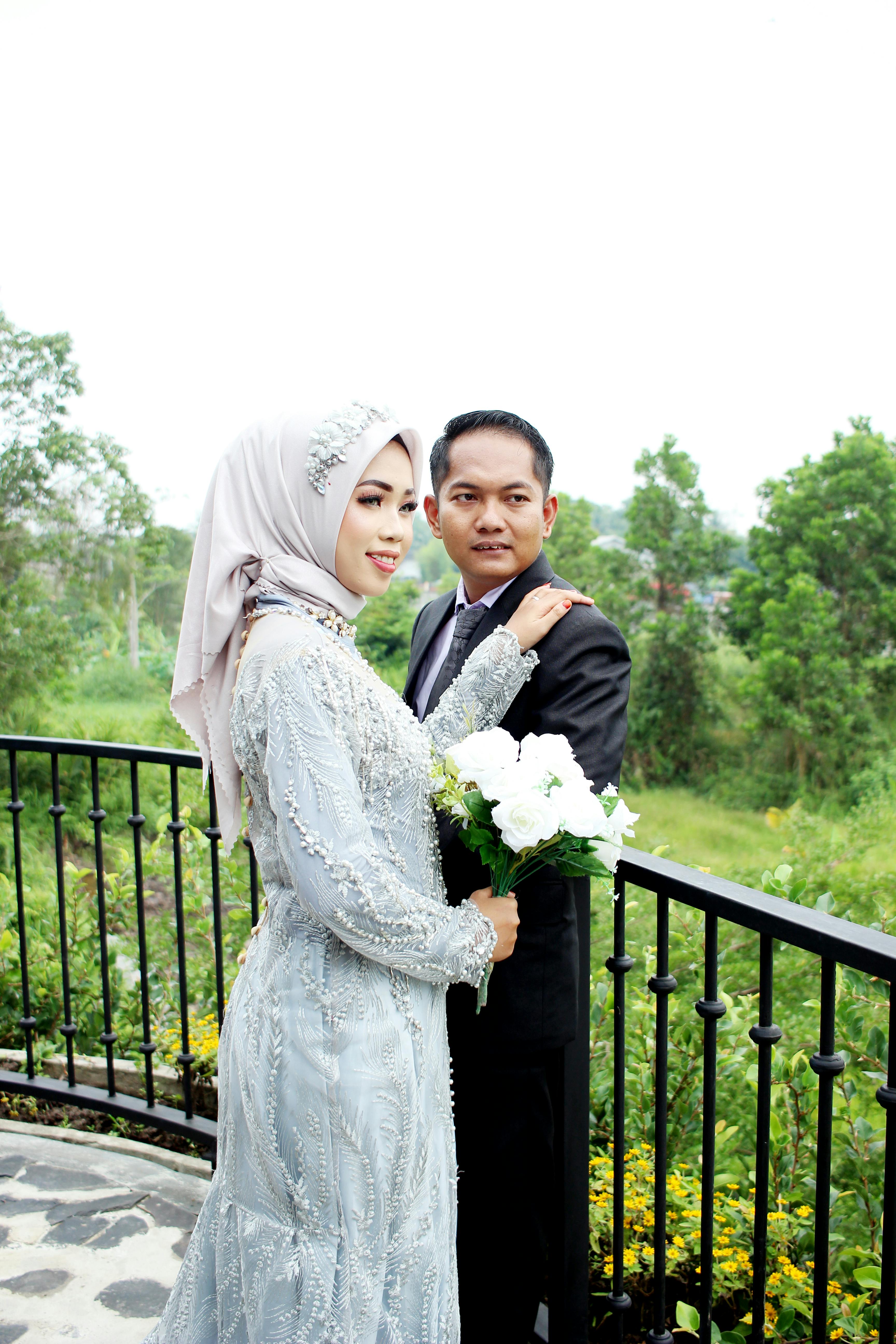 Couple in Traditional Wear · Free Stock Photo