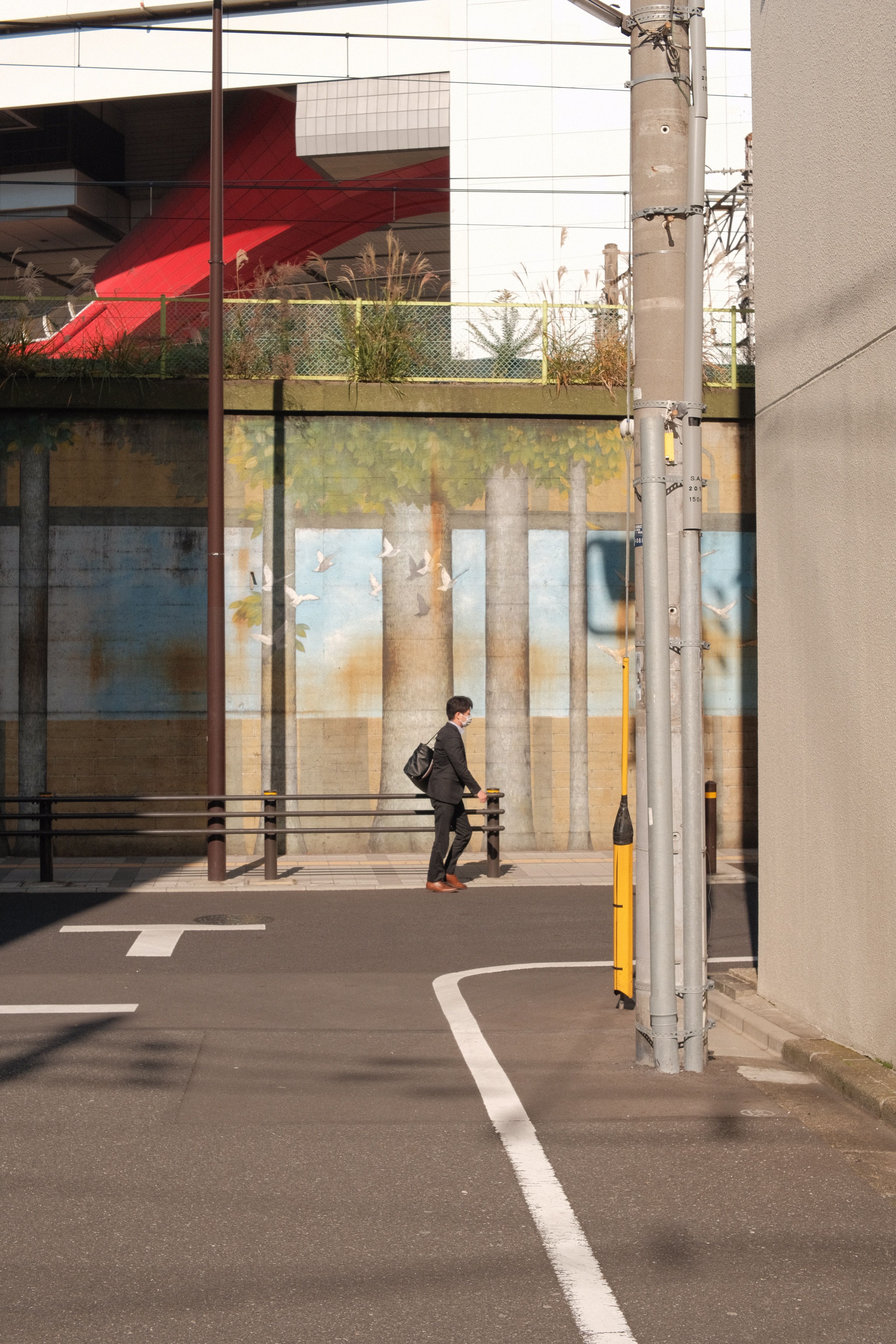 A Man Walking on the Street · Free Stock Photo
