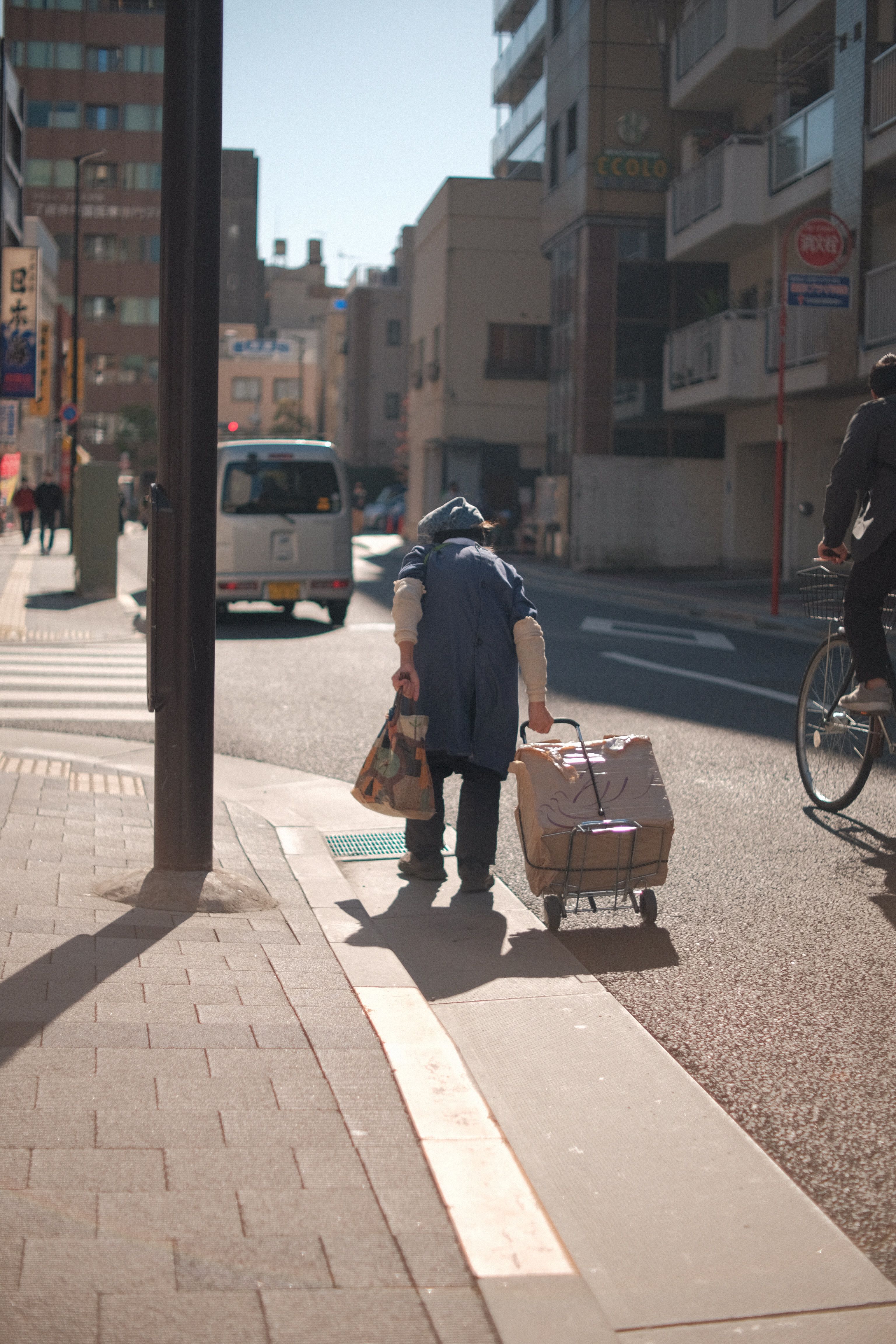 A Back View of People Walking on the Street · Free Stock Photo