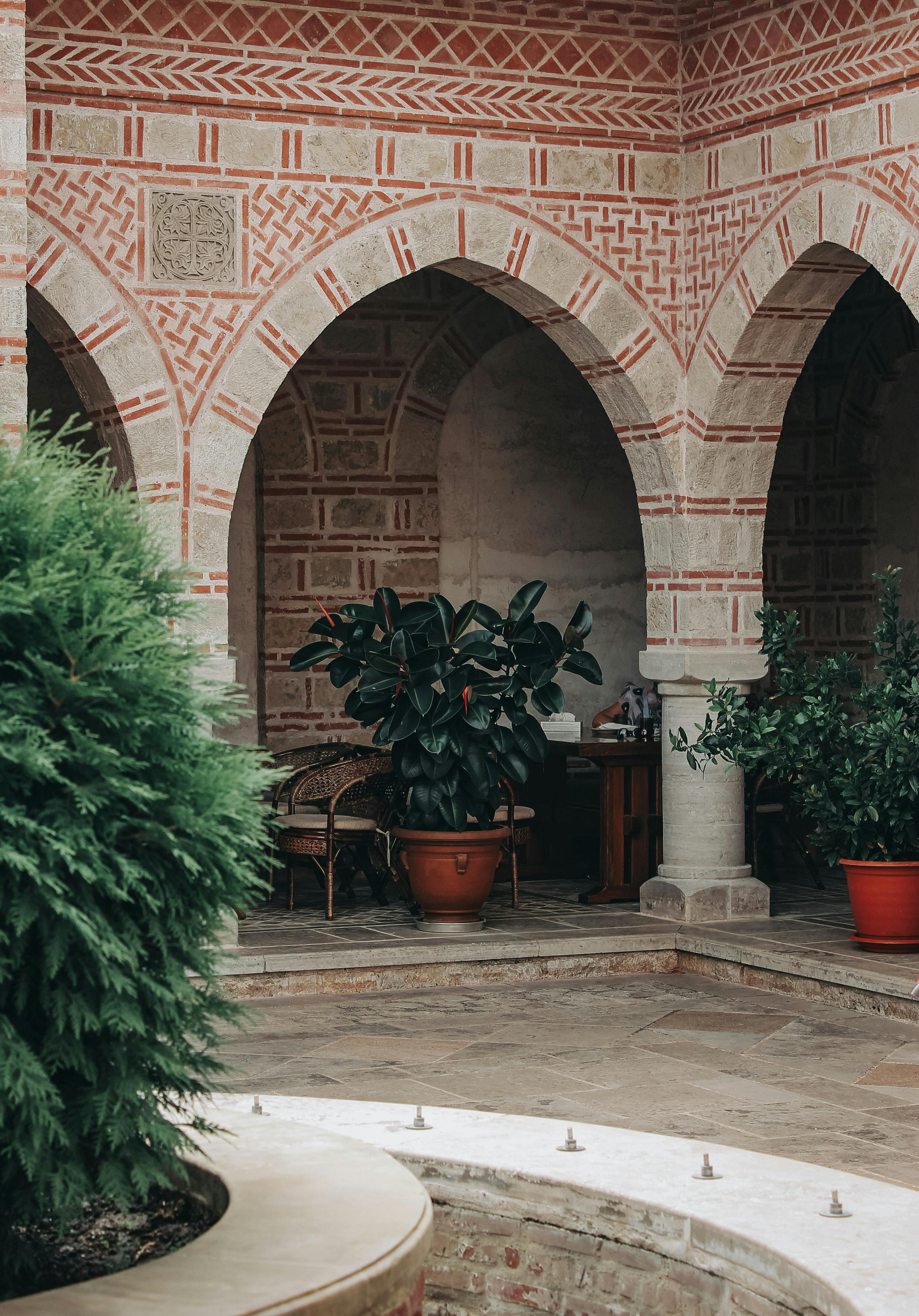 Arched Courtyard with Potted Plants · Free Stock Photo