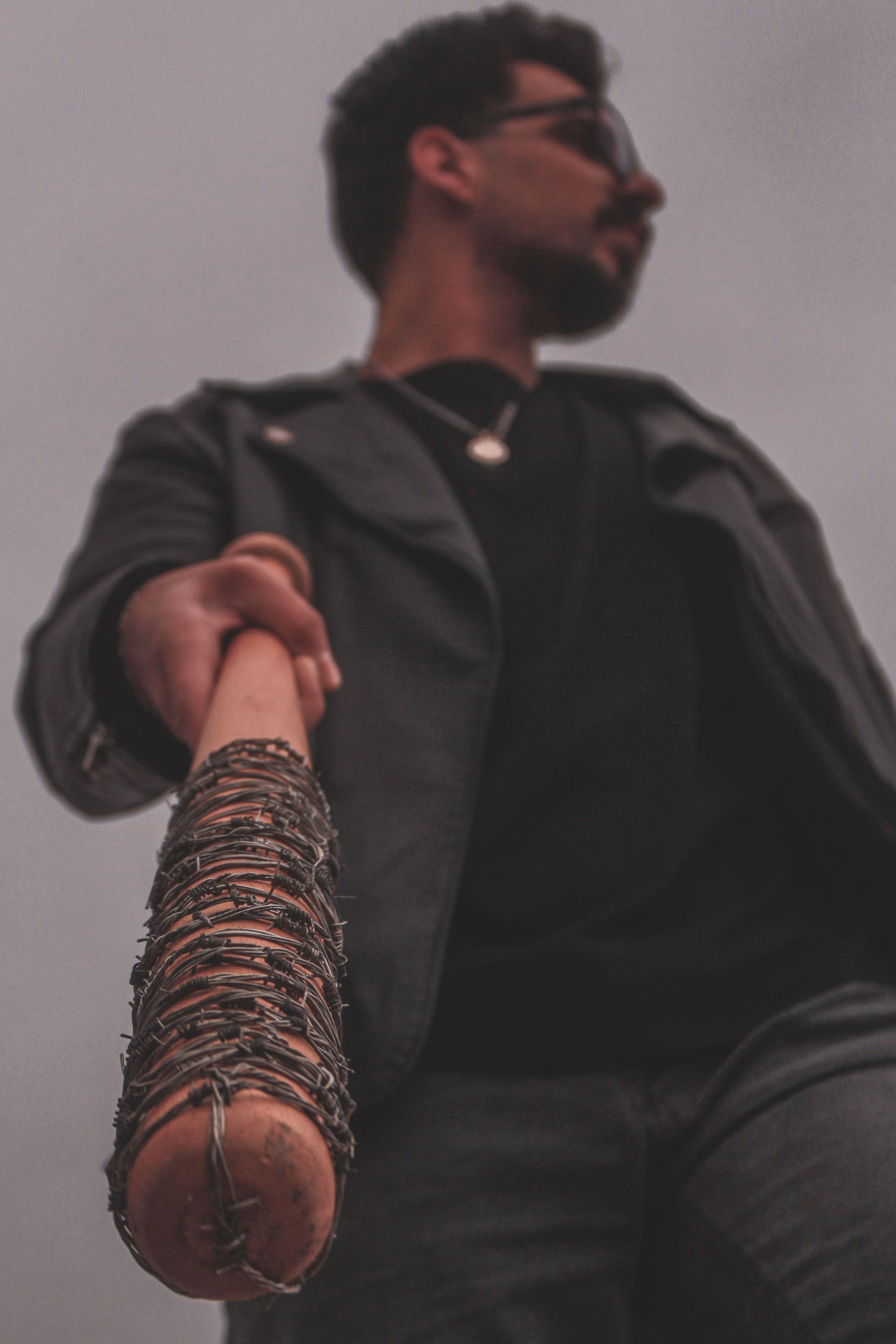 Low Angle Shot of Man holding a Baseball Bat · Free Stock Photo