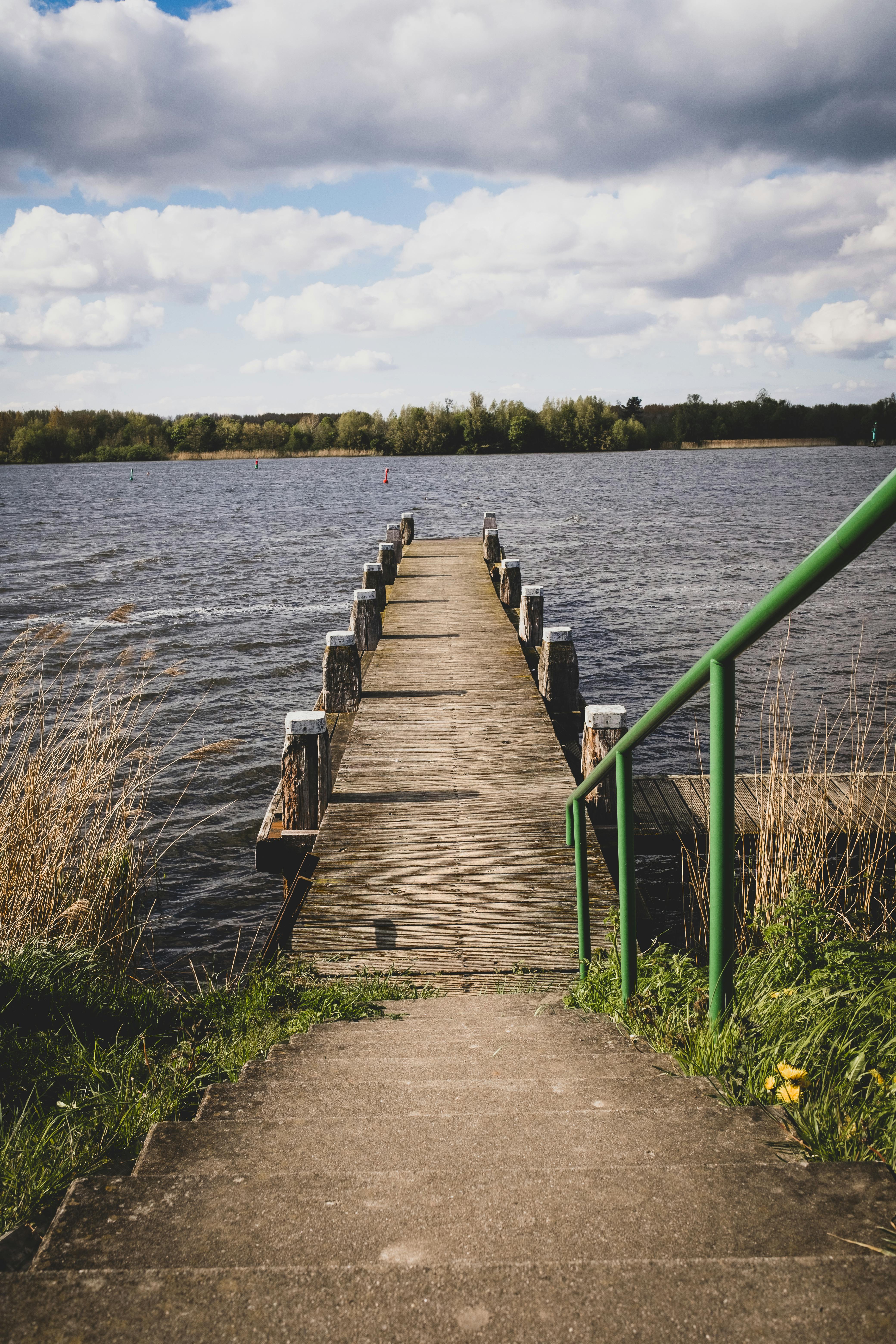 Short Wooden Dock with Signage · Free Stock Photo