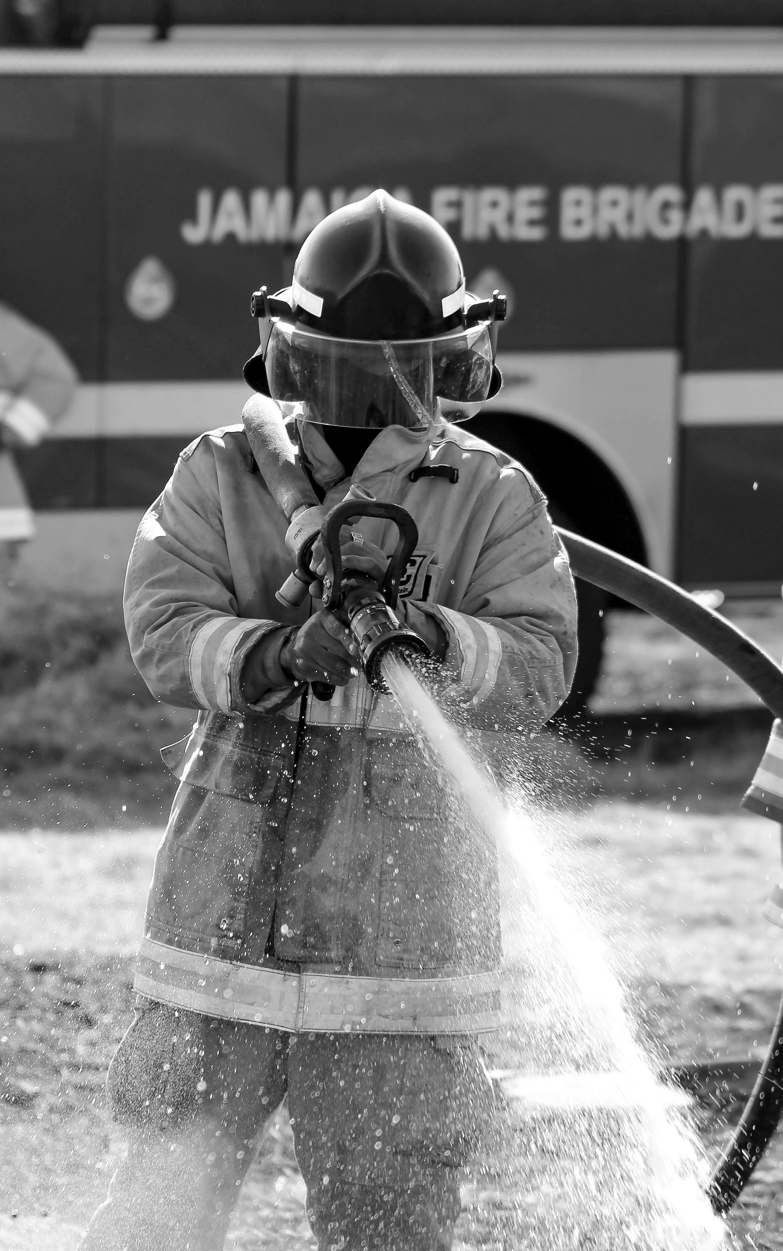 Grayscale Photo of a Firefighter · Free Stock Photo