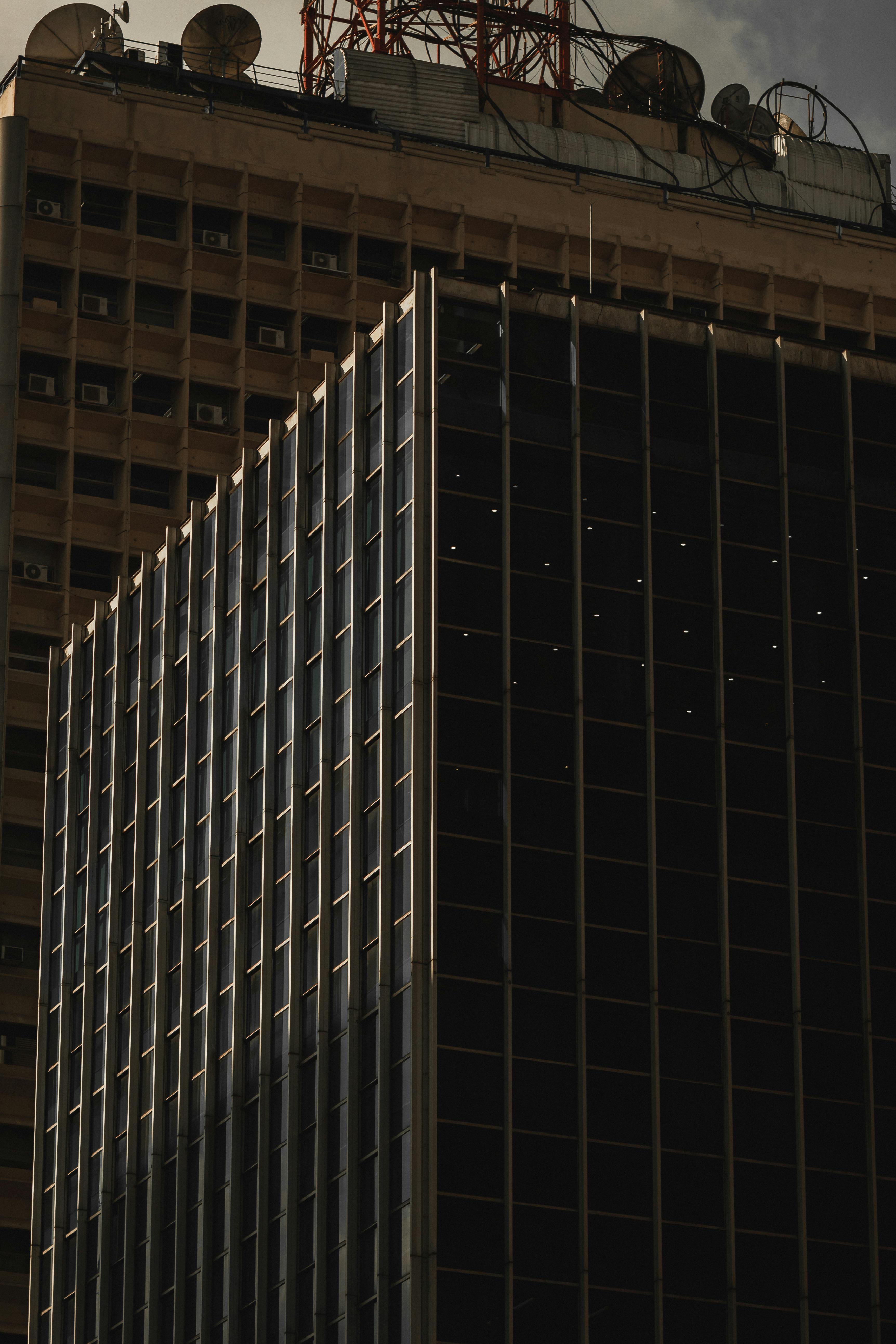 A Building with Glass Panels · Free Stock Photo