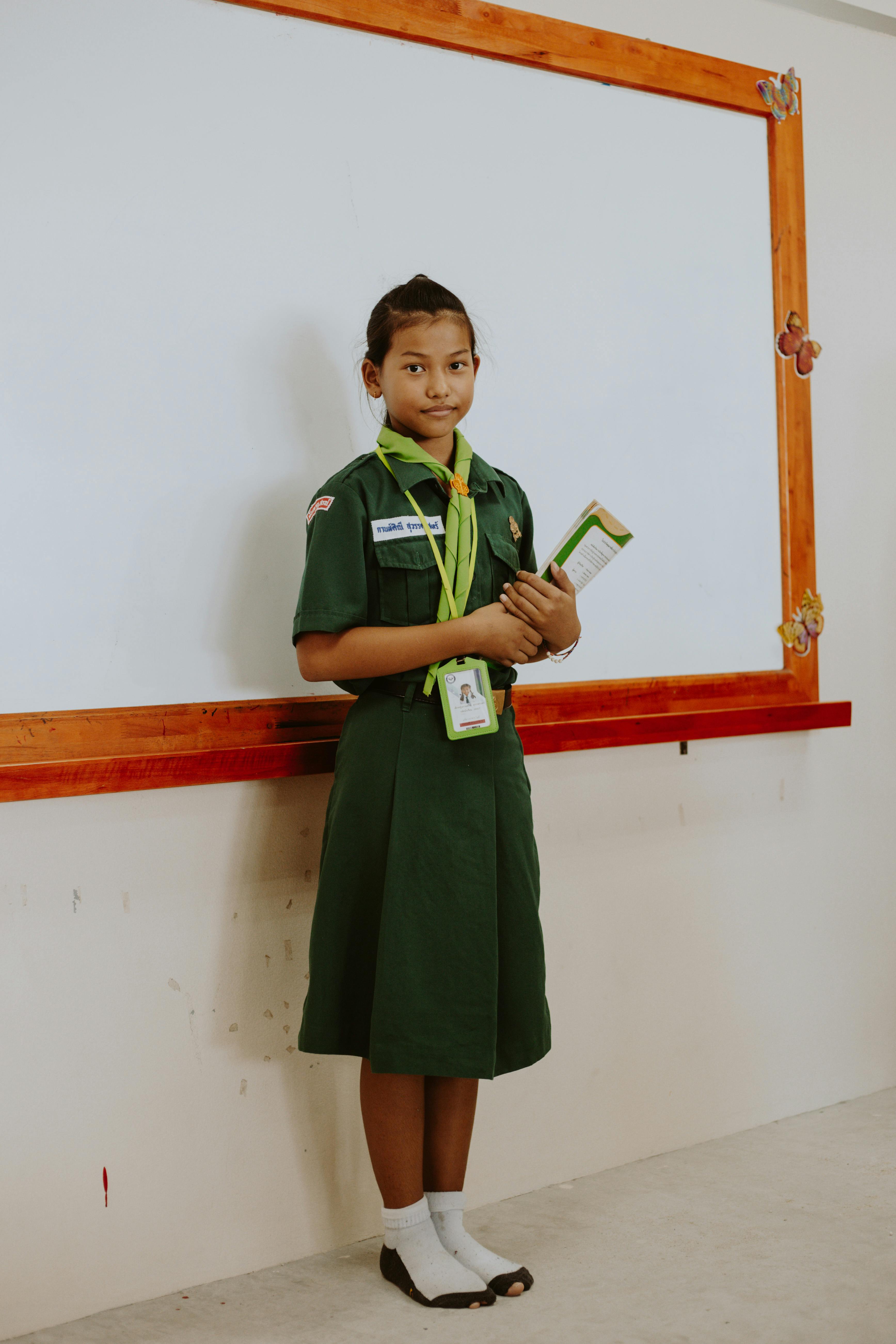 Neat Student in Green Uniform · Free Stock Photo