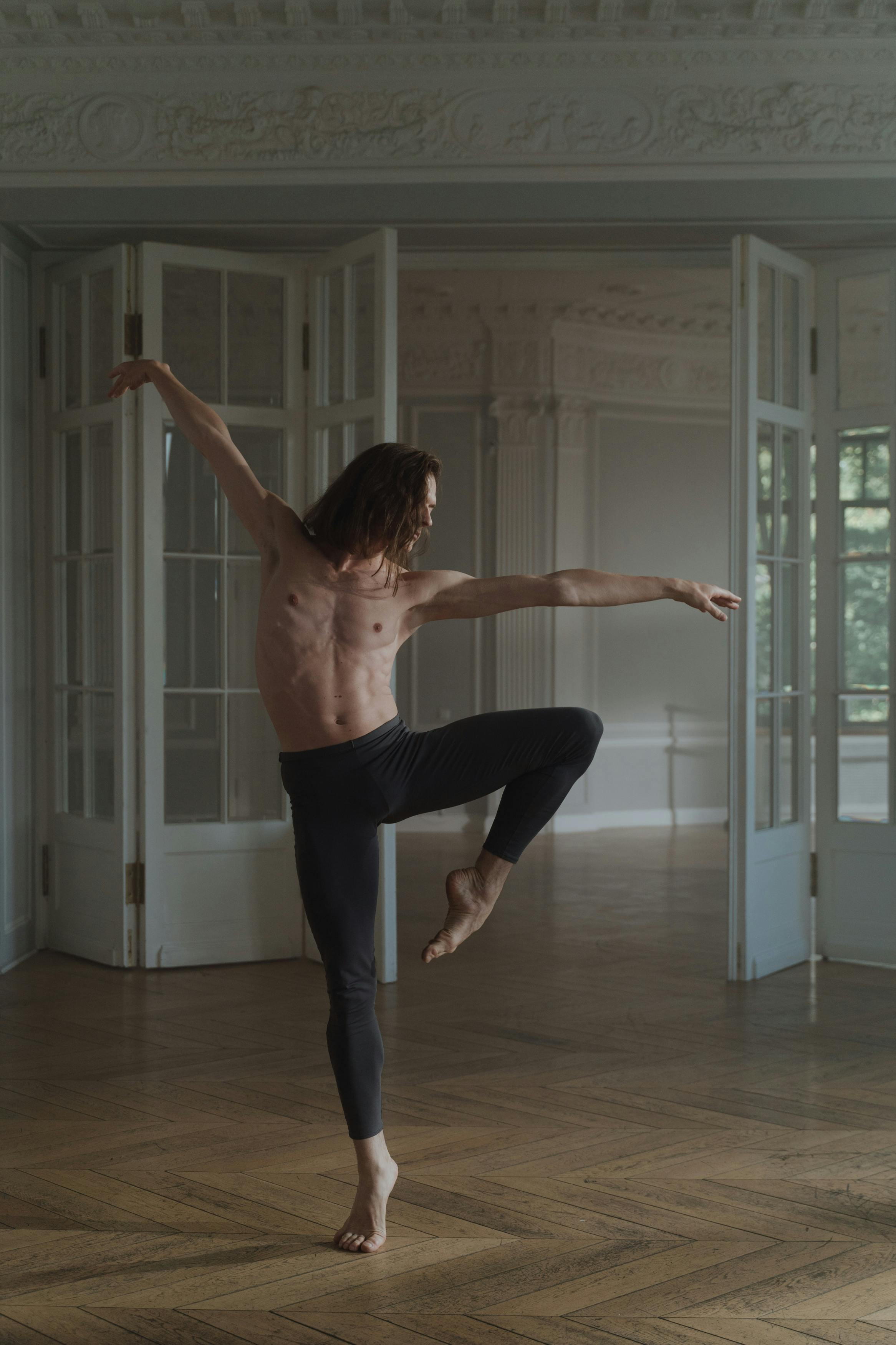 A Shirtless Man Dancing Gracefully · Free Stock Photo