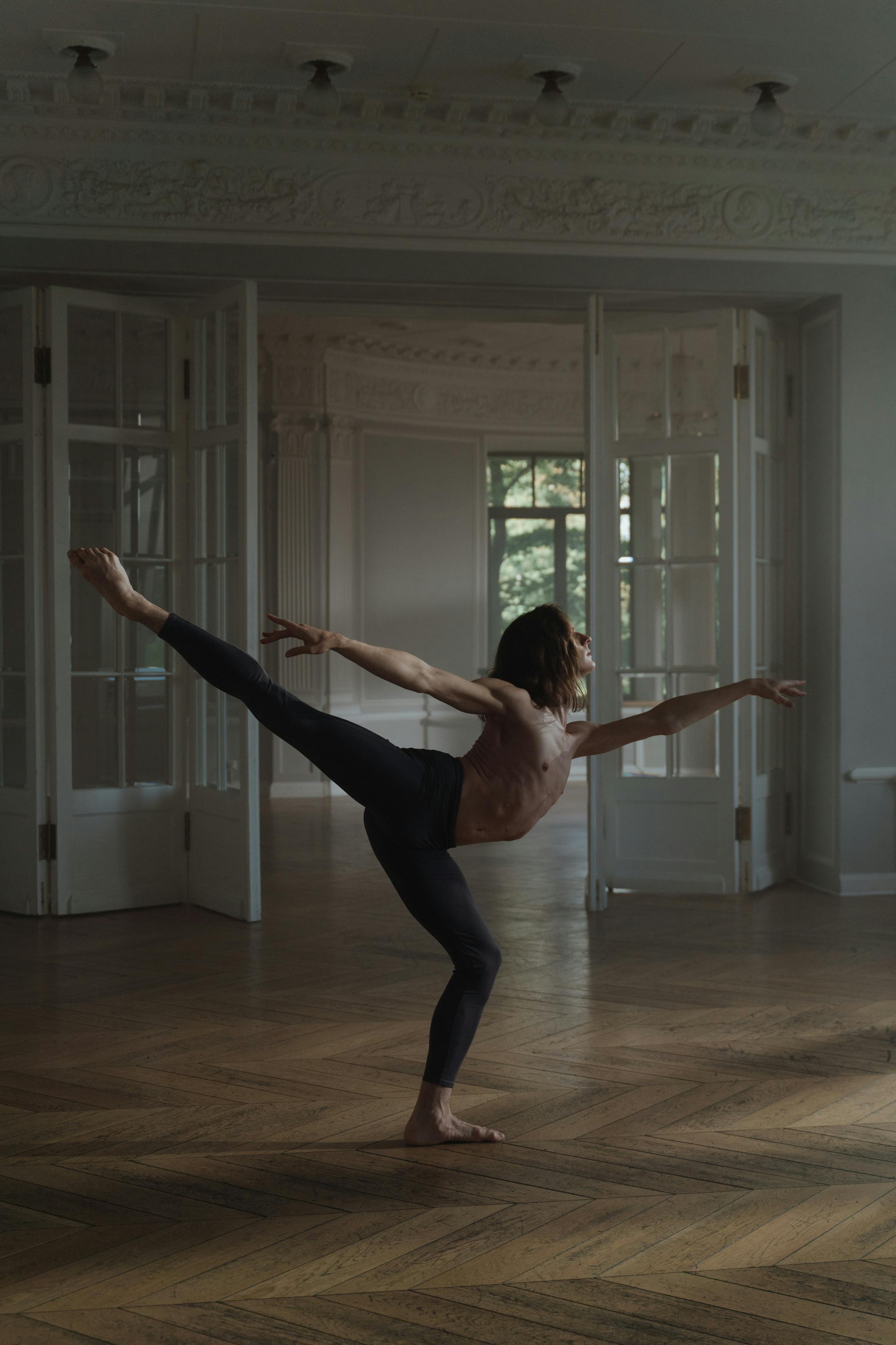 A Shirtless Man Dancing Gracefully · Free Stock Photo