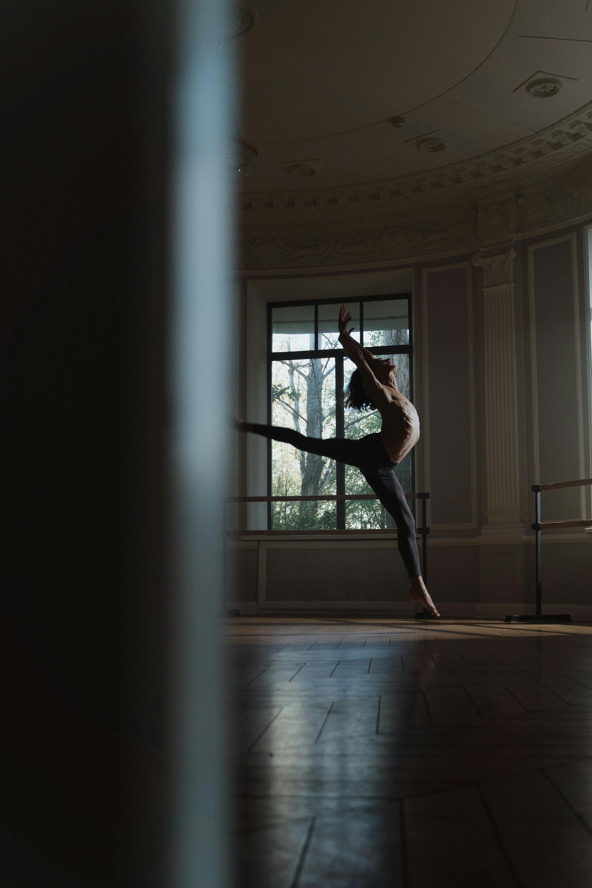 A Shirtless Man Dancing Gracefully · Free Stock Photo