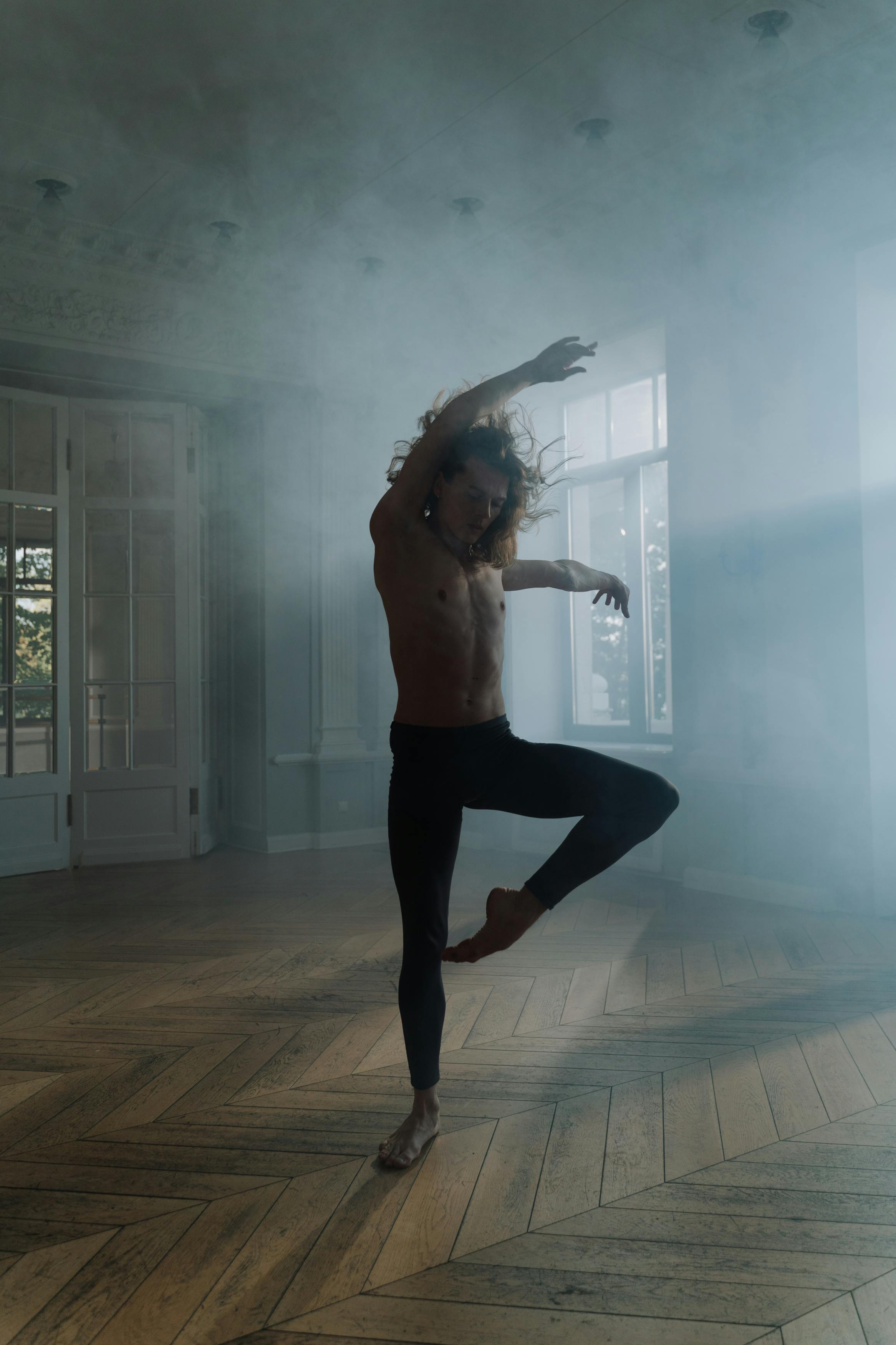 A Shirtless Man Dancing Gracefully · Free Stock Photo