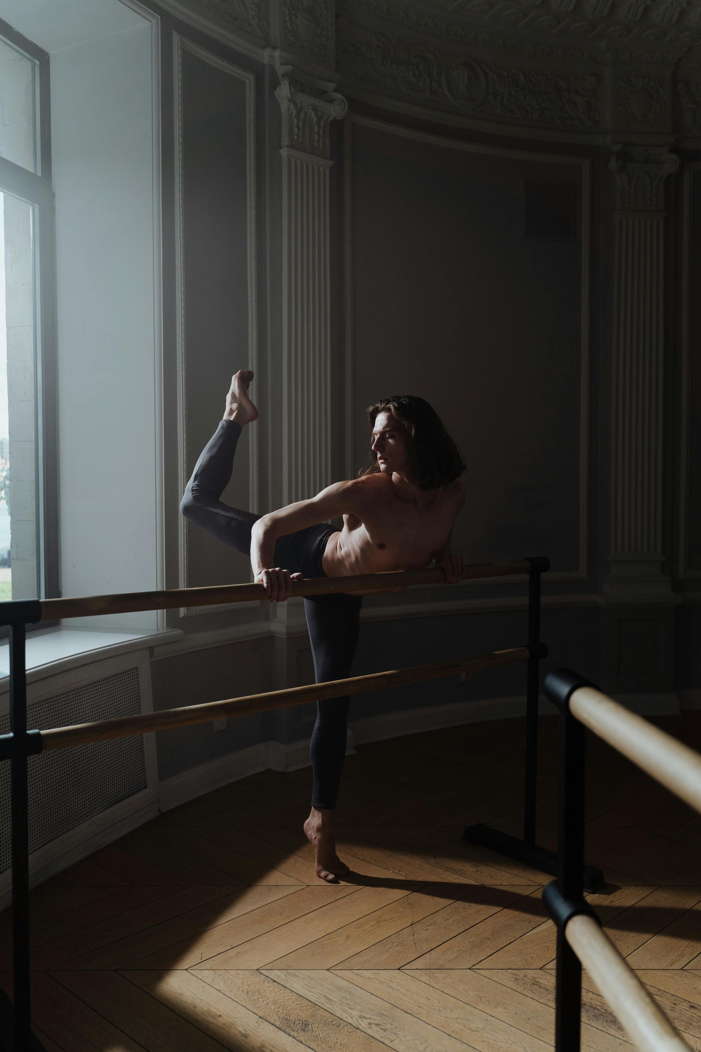 A Shirtless Man Dancing Gracefully · Free Stock Photo