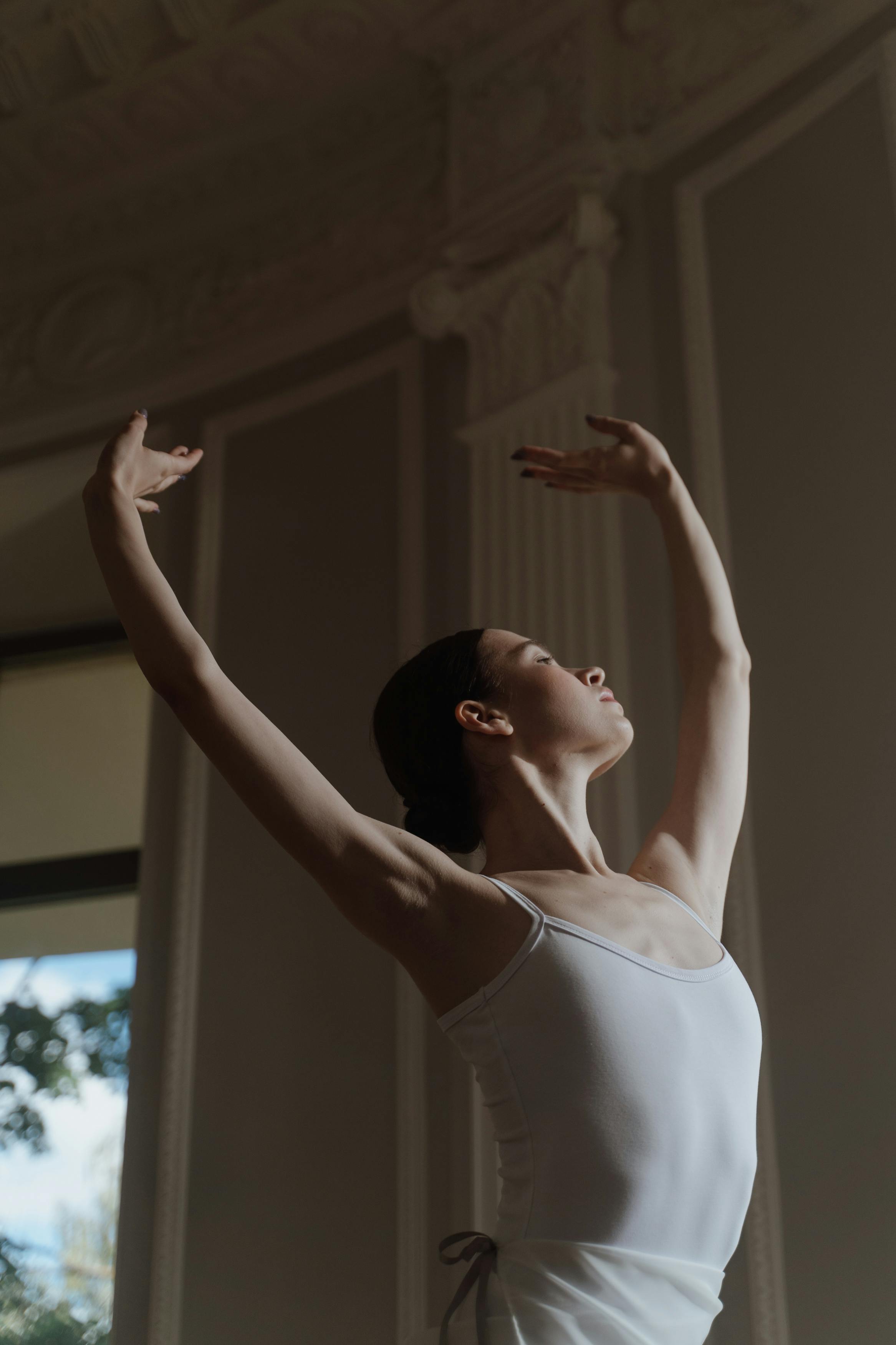 Low-Angle Shot of a Woman Dancing · Free Stock Photo