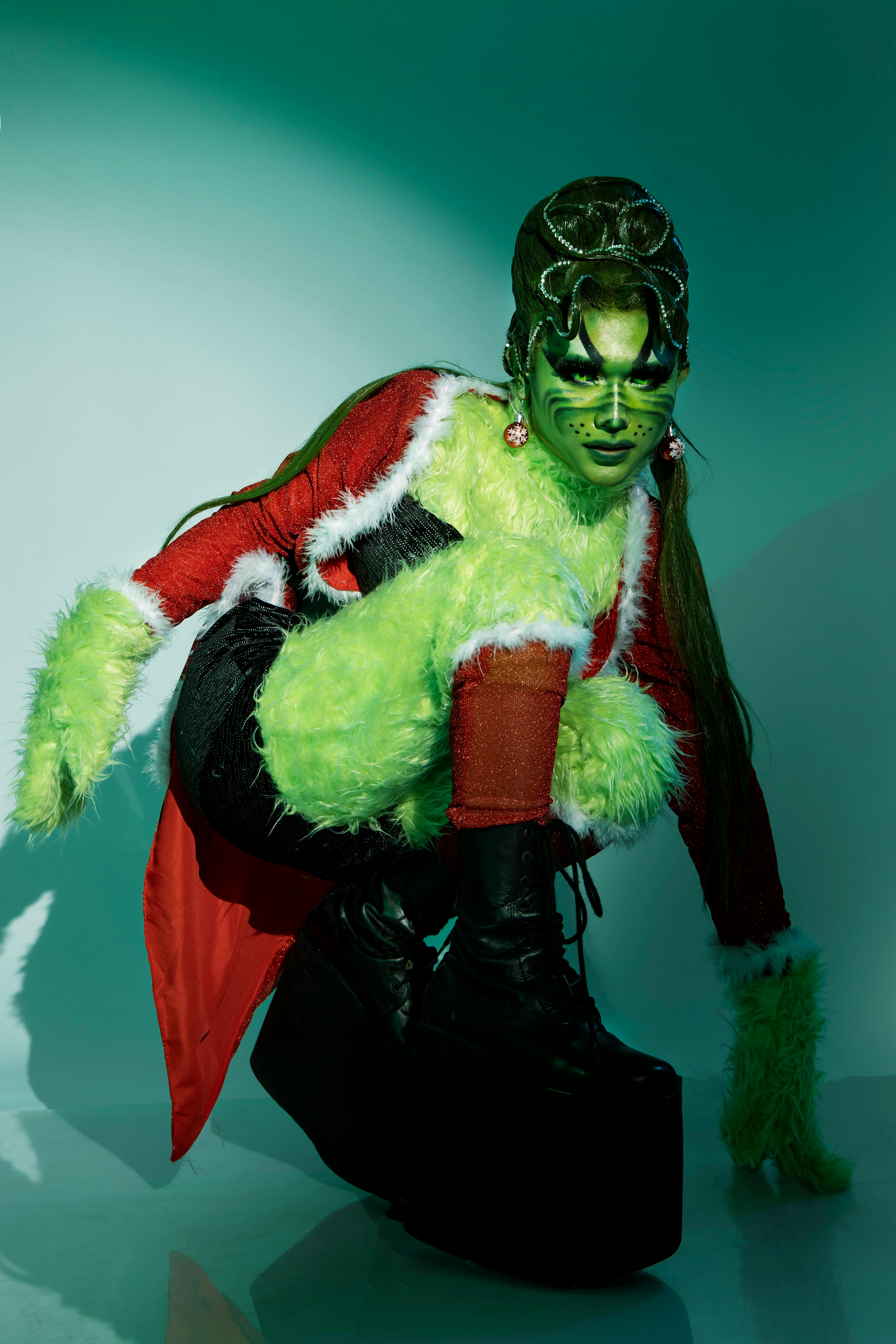 Woman Posing in Grinch Costume · Free Stock Photo