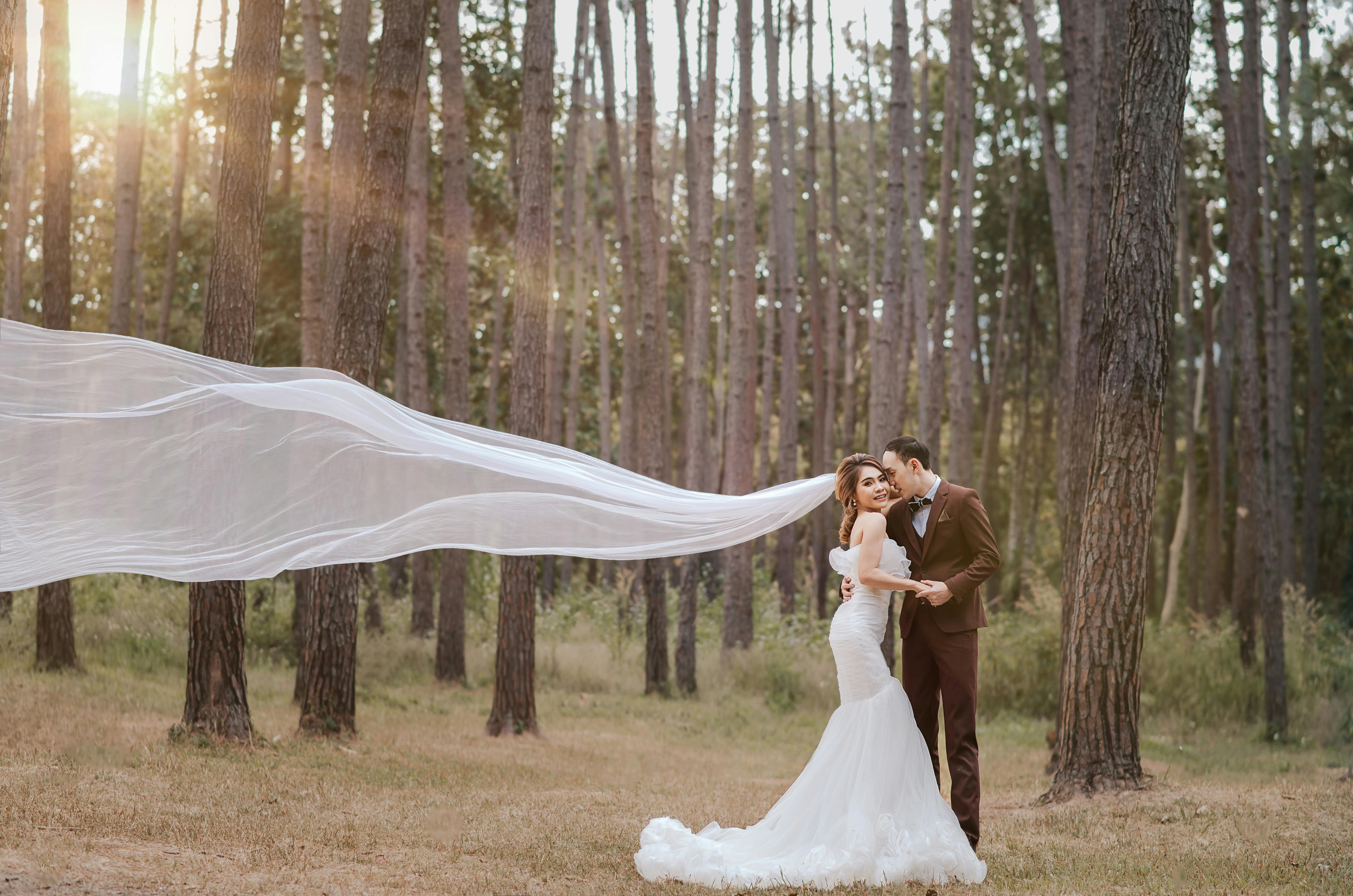 A Romantic Couple Standing in the Forest · Free Stock Photo