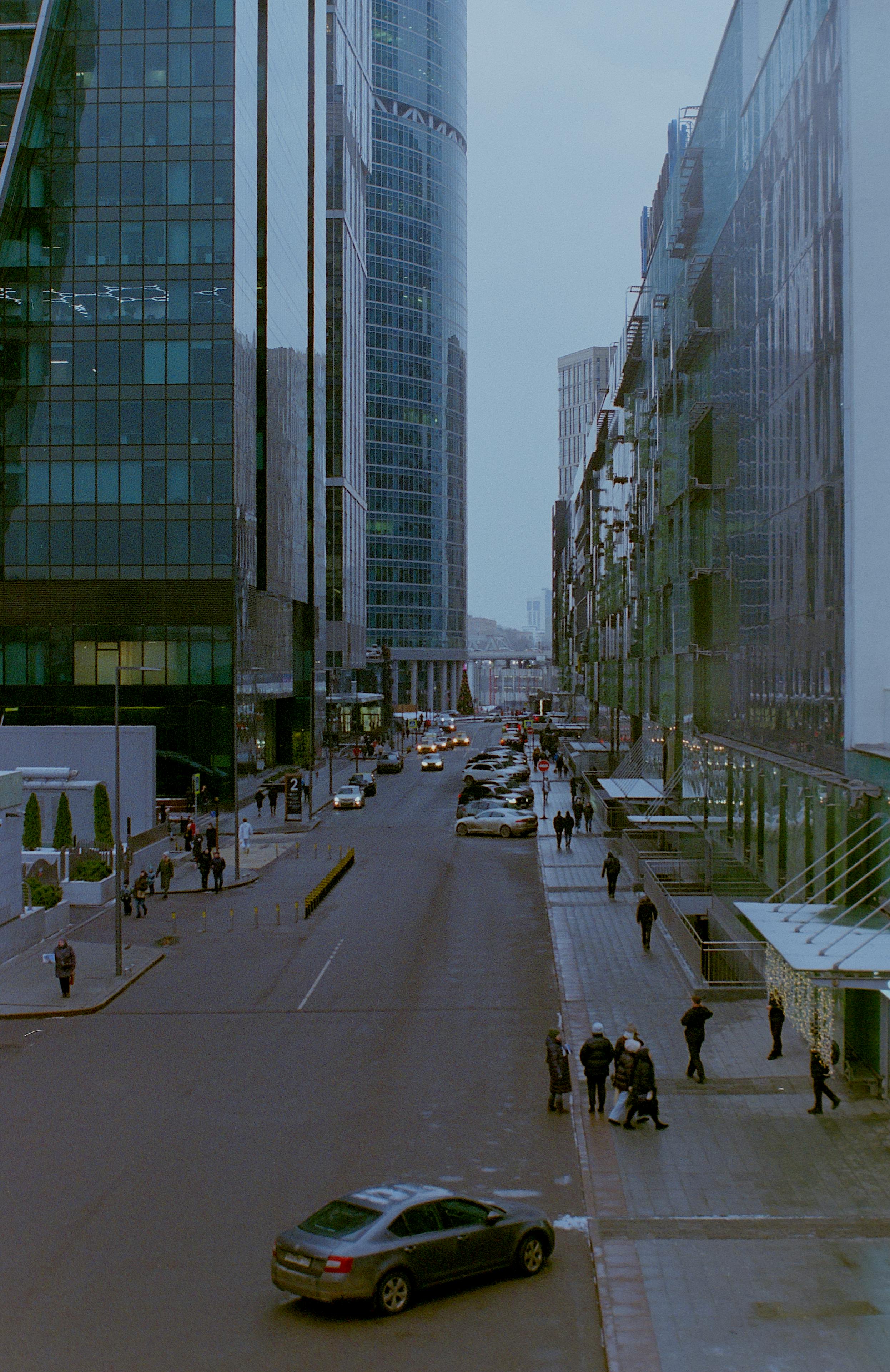 High-Angle Shot of People Walking on City Street near High Rise ...