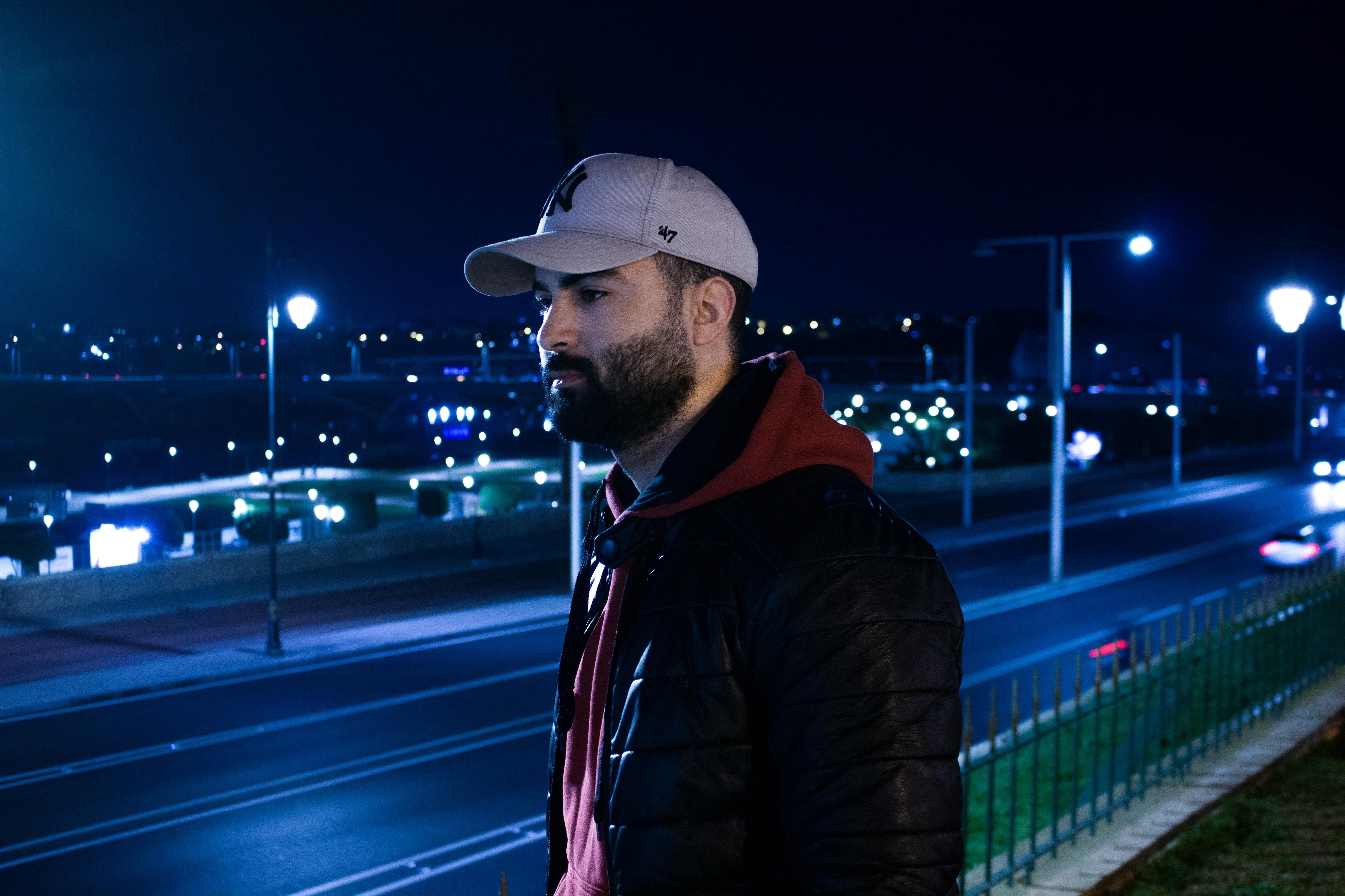 Civilian walking on Roadside · Free Stock Photo
