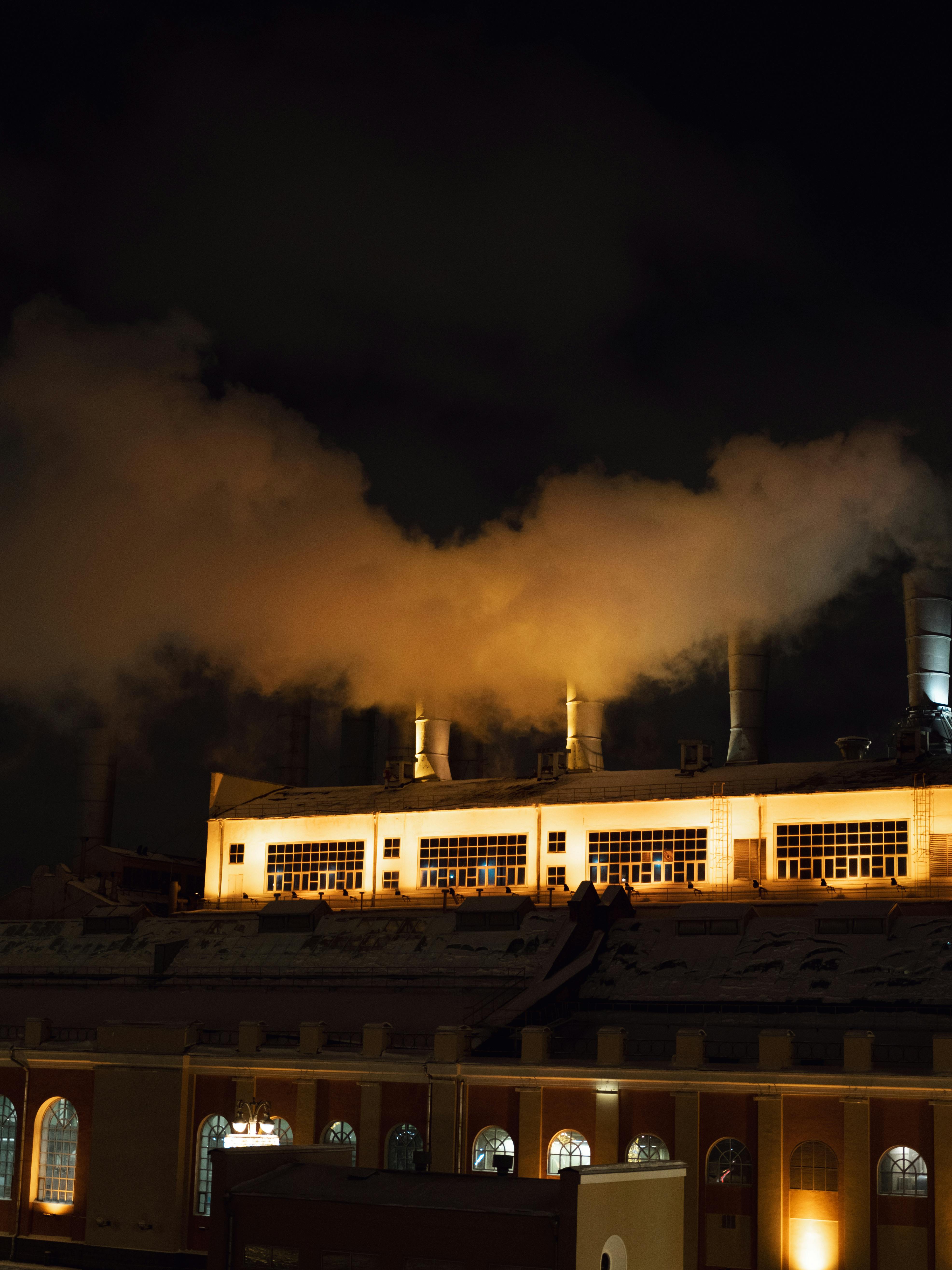 A Concrete Building at Night · Free Stock Photo