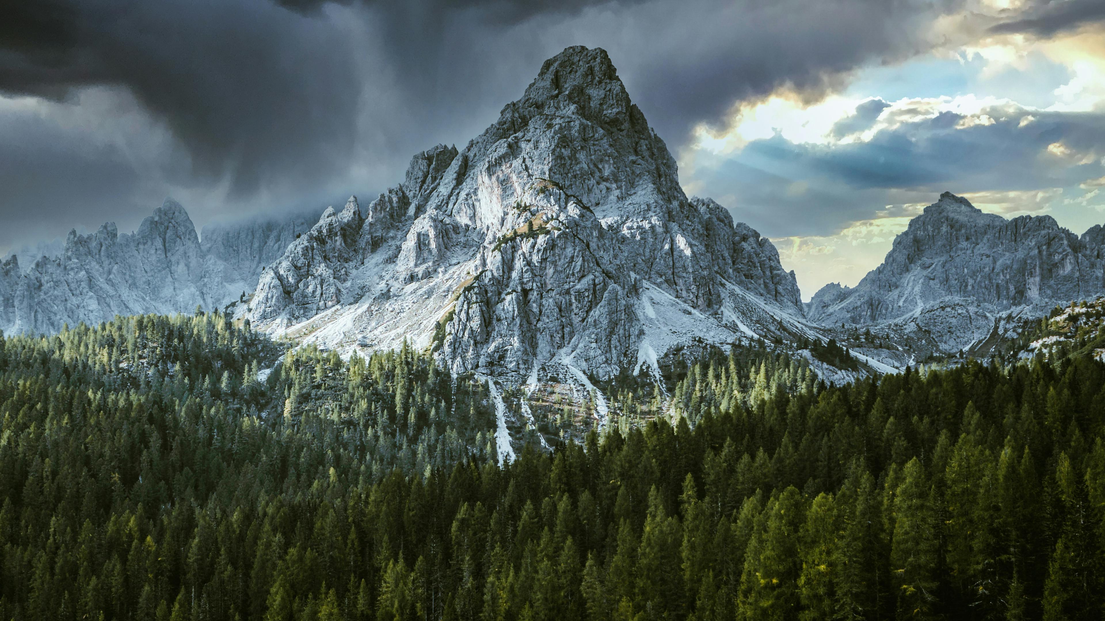 Green Trees Near Snow Covered Rocky Mountain · Free Stock Photo