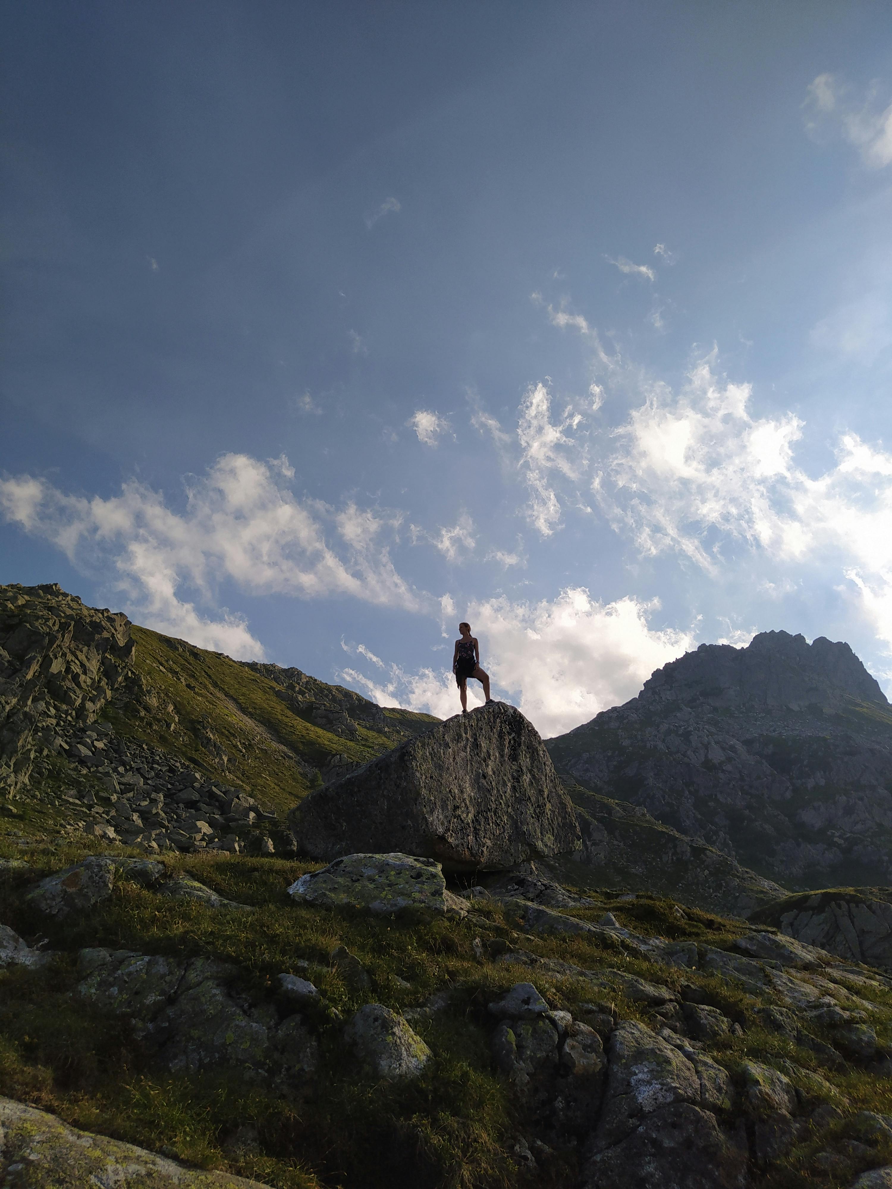 A Woman Standing on a Rock · Free Stock Photo