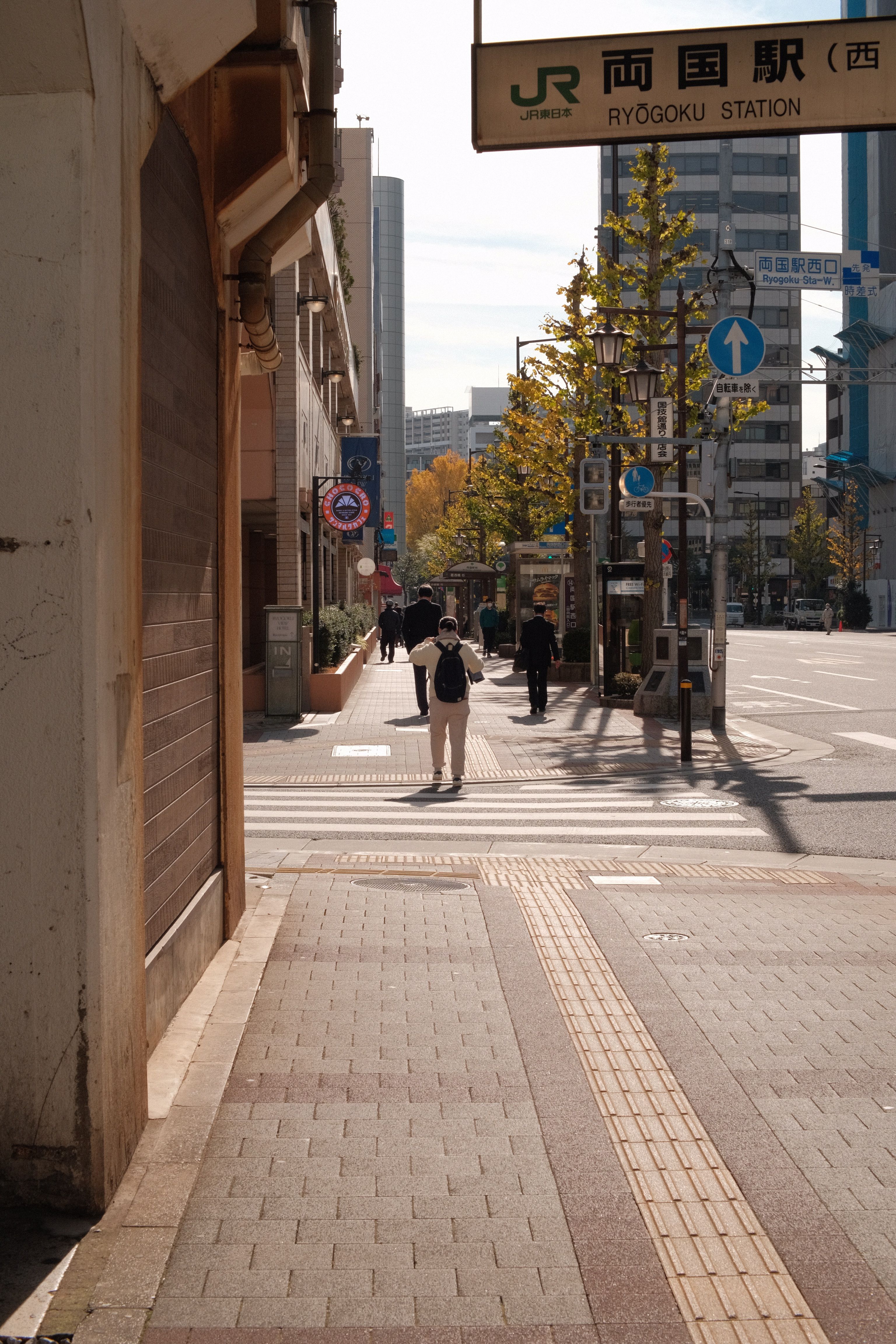 Two People Walking on the Sidewalk · Free Stock Photo
