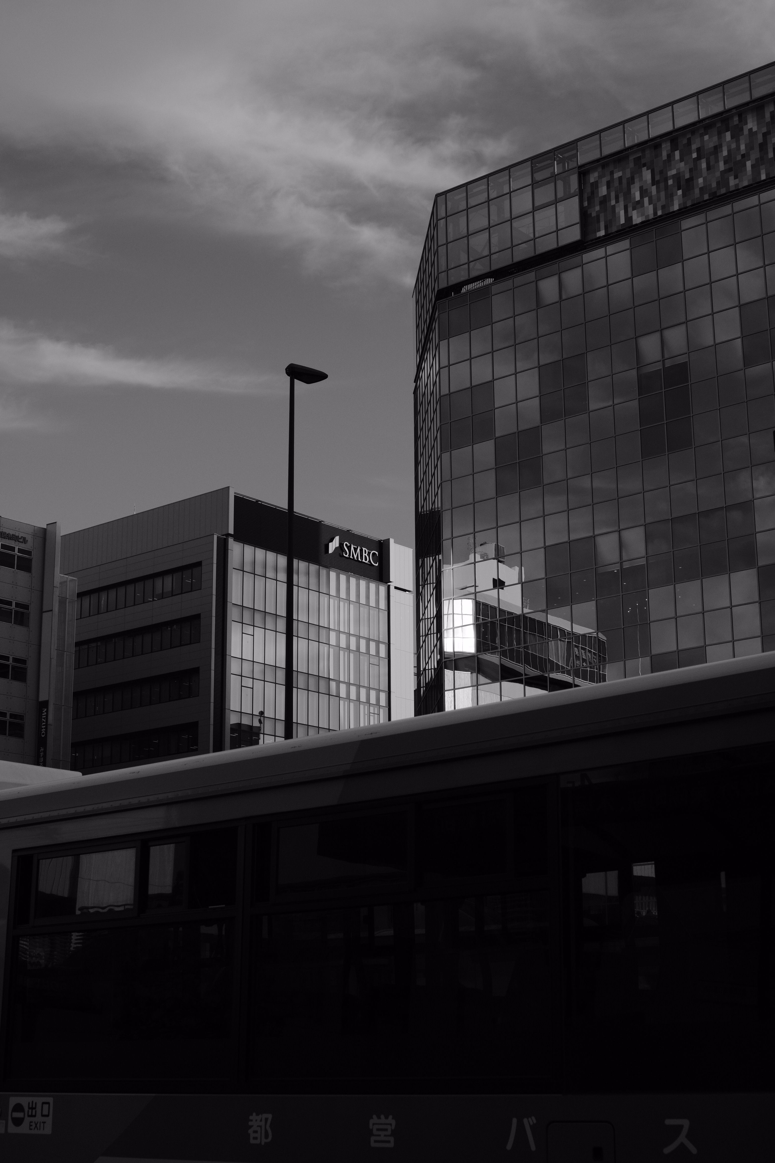 People Waiting on the Street Beside a Building · Free Stock Photo