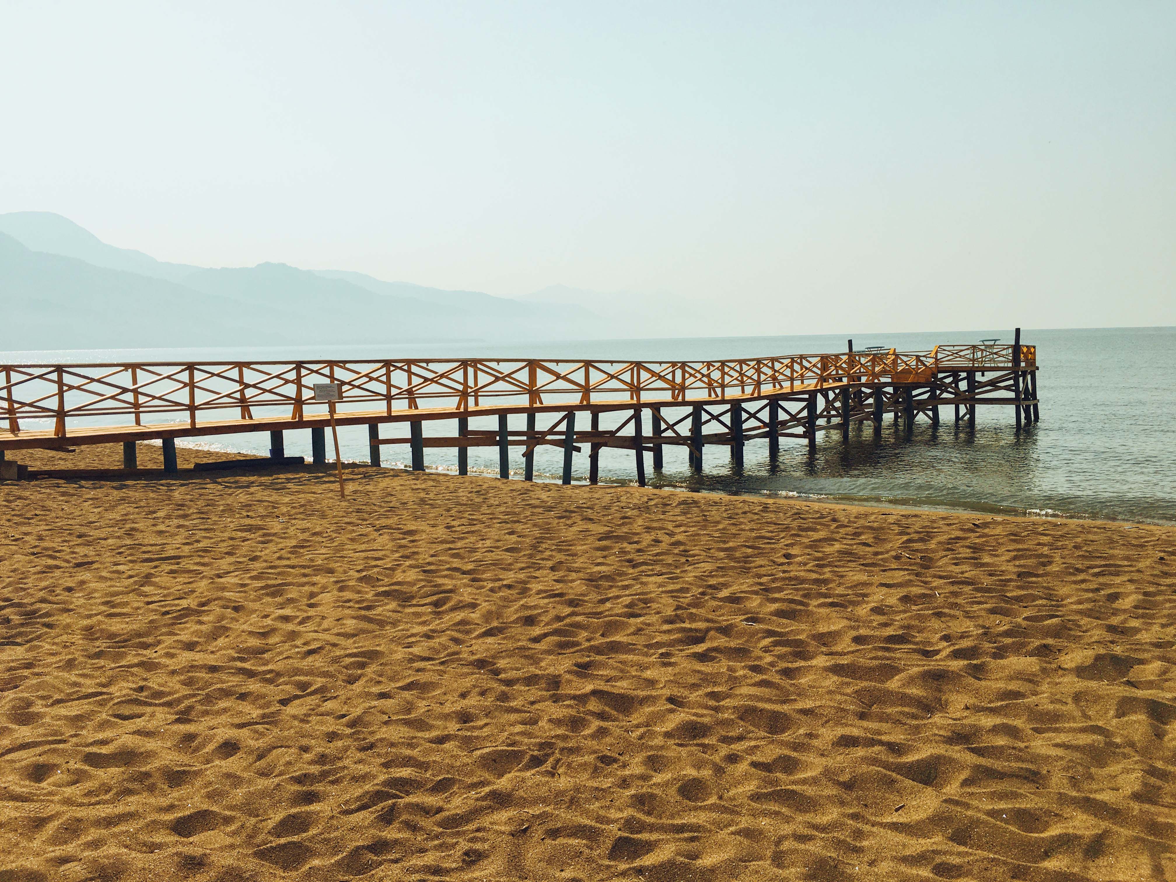 Scenic View of a Wooden Dock Near the Sea · Free Stock Photo