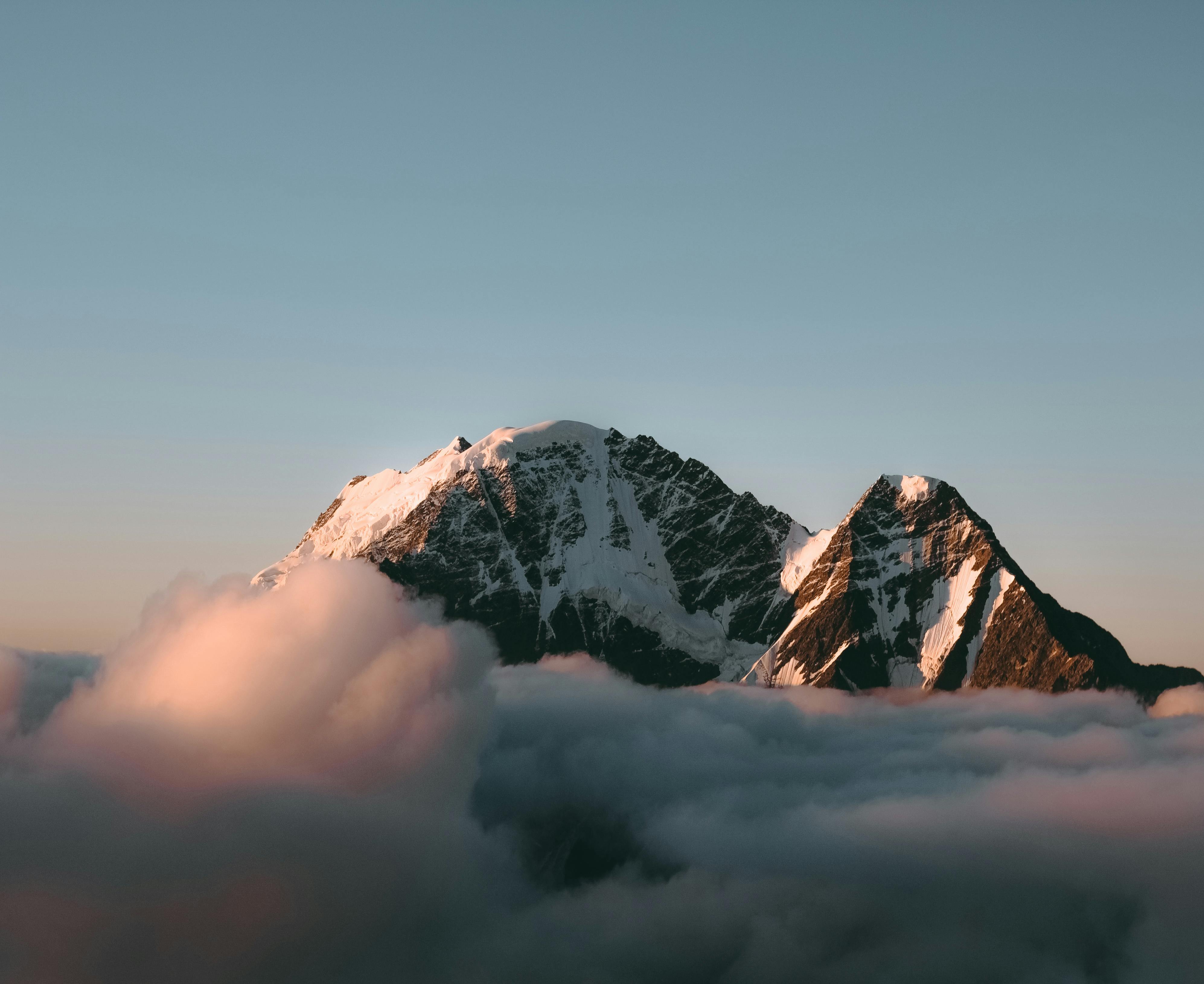 Mountain Peak over Clouds · Free Stock Photo