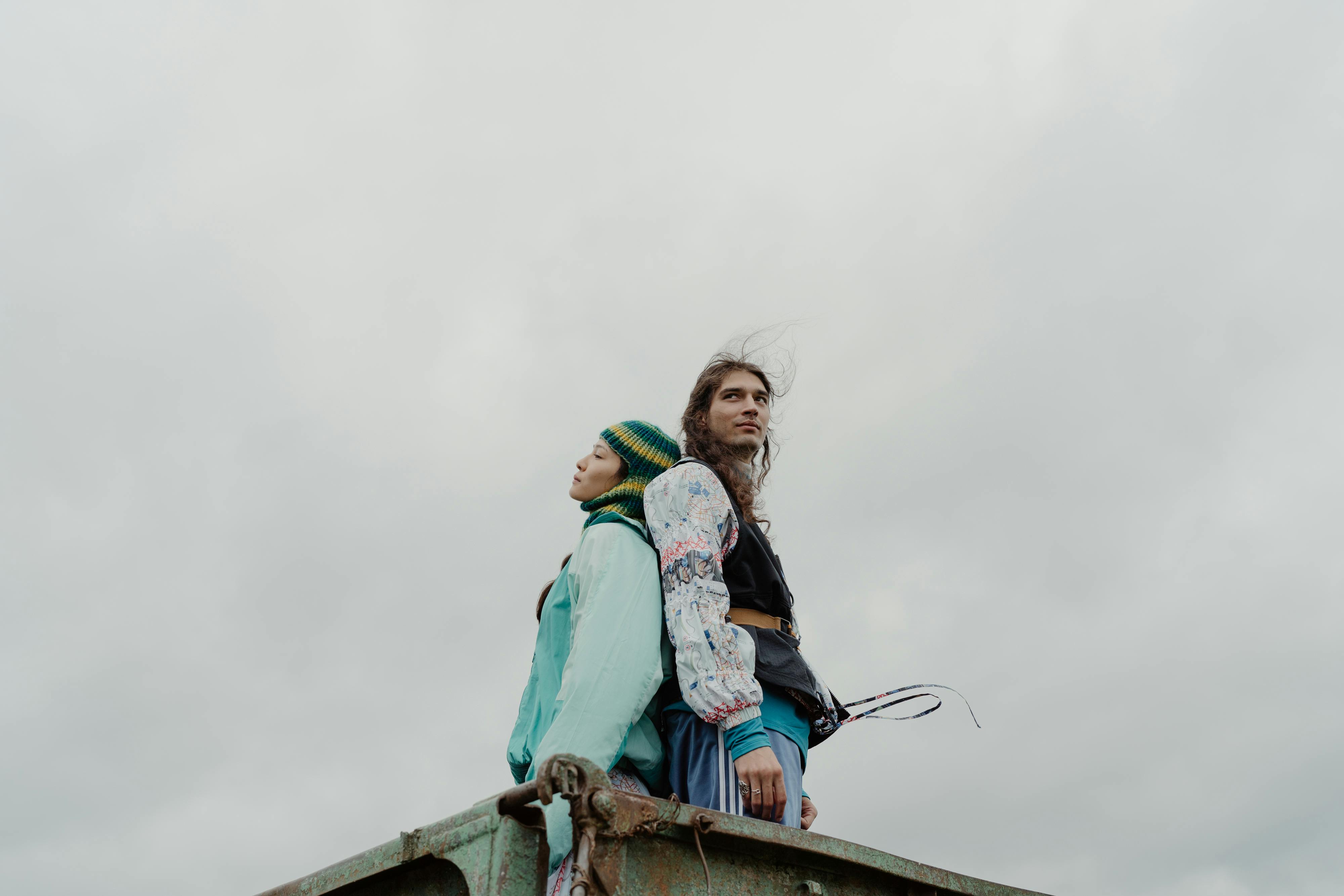 Women Leaning Back to Back · Free Stock Photo