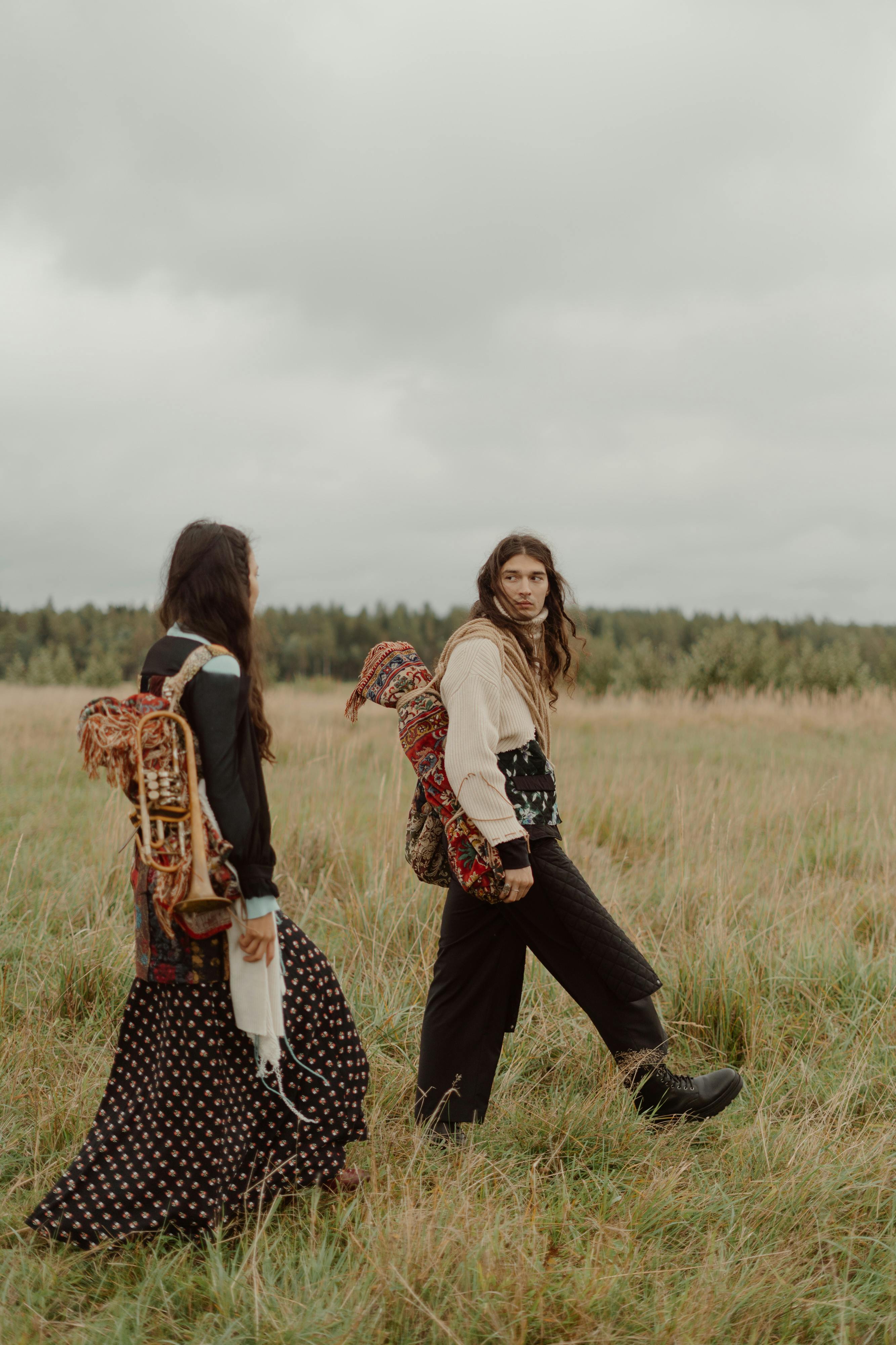 Hippie Couple Walking on Grass · Free Stock Photo