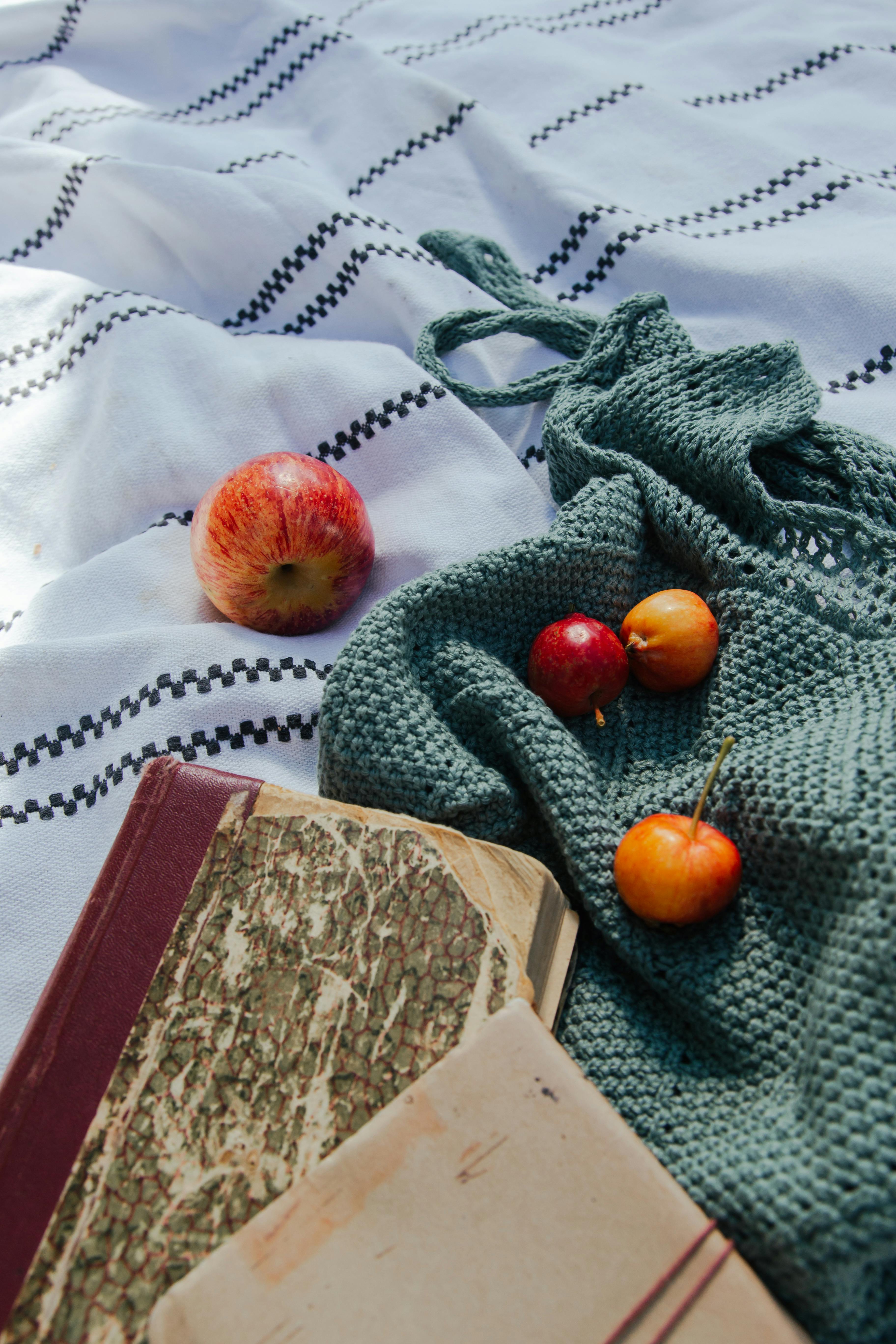 Close up on Apples on Blanket and Clothes · Free Stock Photo